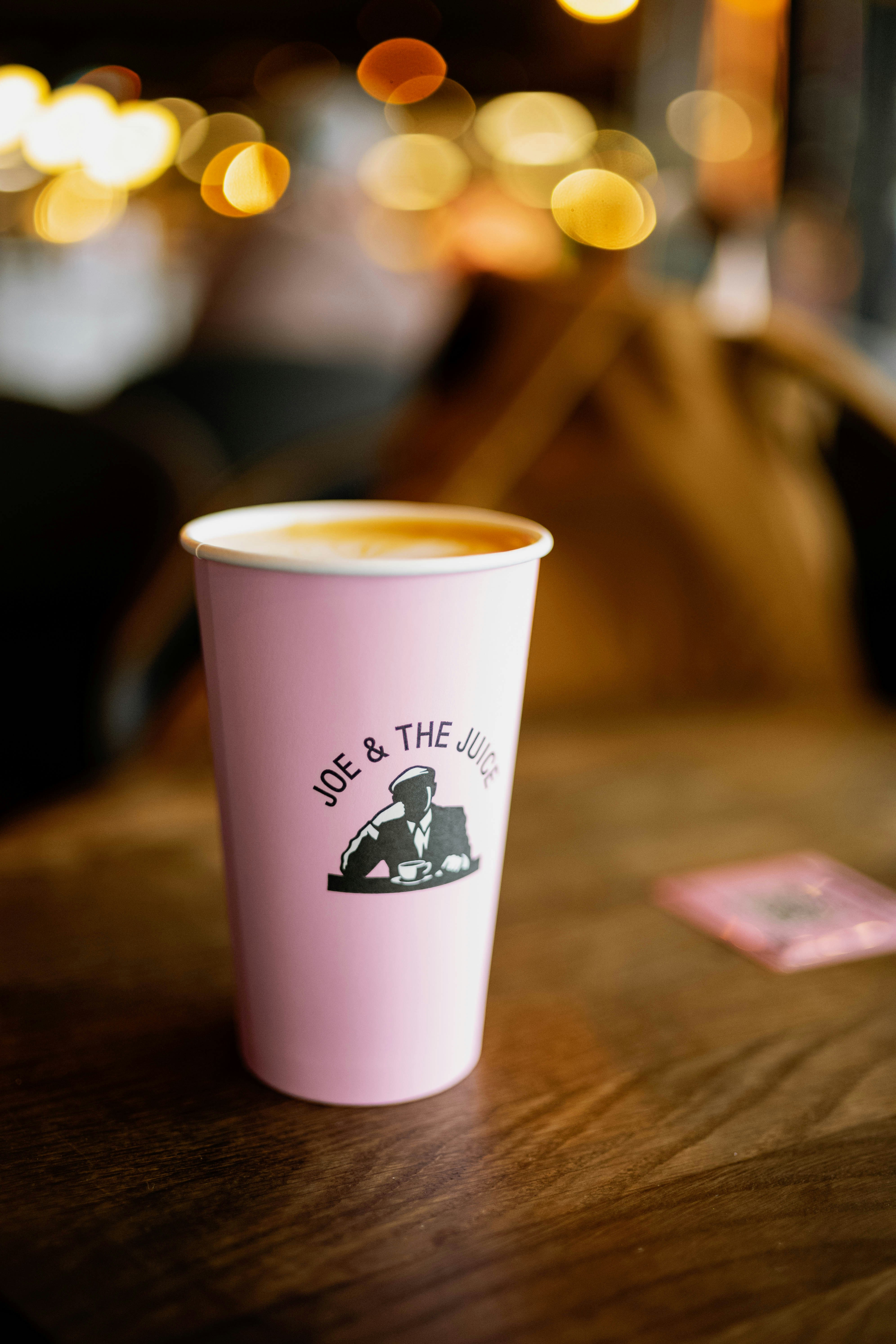Pink Cup in Focus: A Quiet Moment at the Café Bar