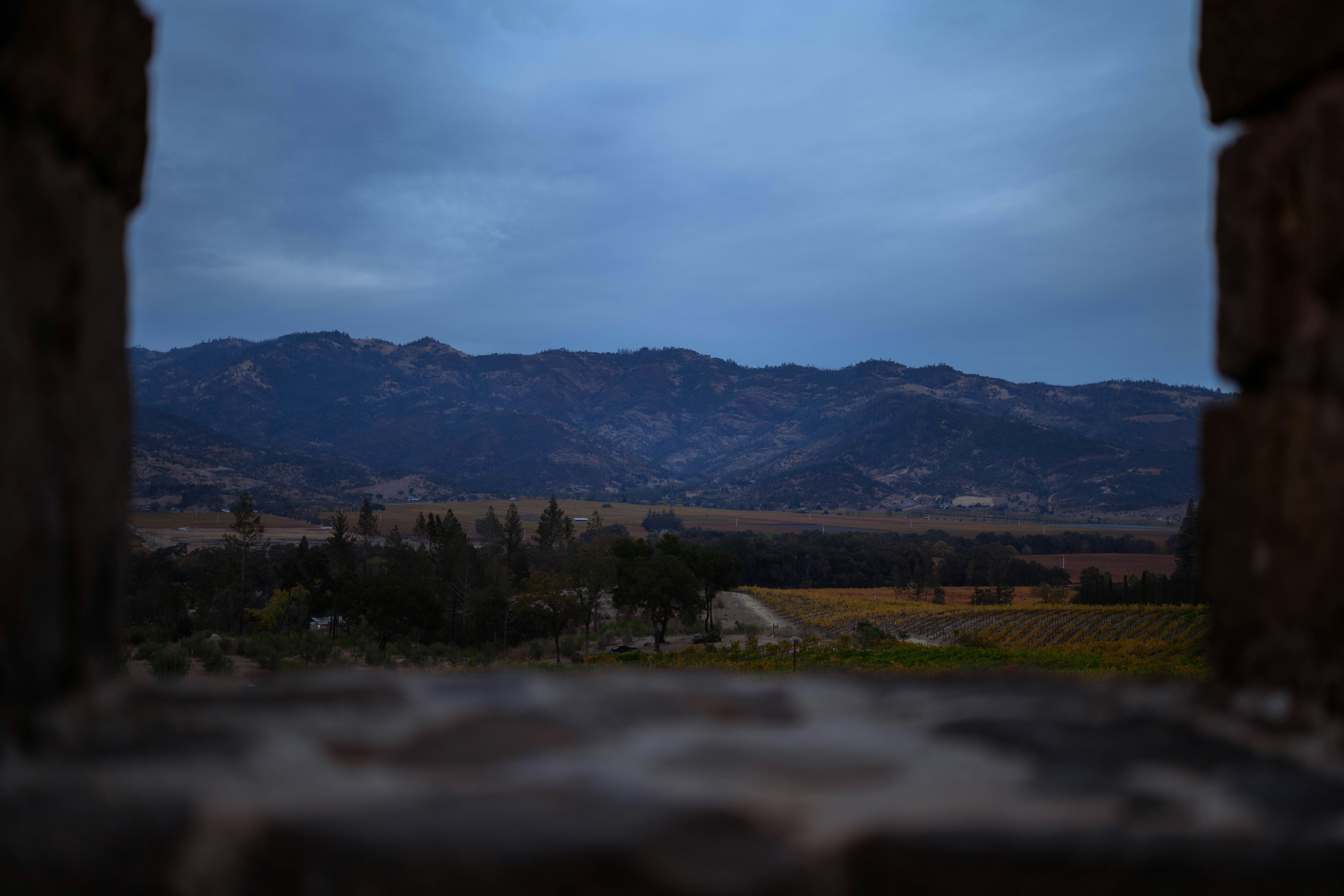 Stone Window Panorama: Distant Mountains Framed by Timeworn Aperture