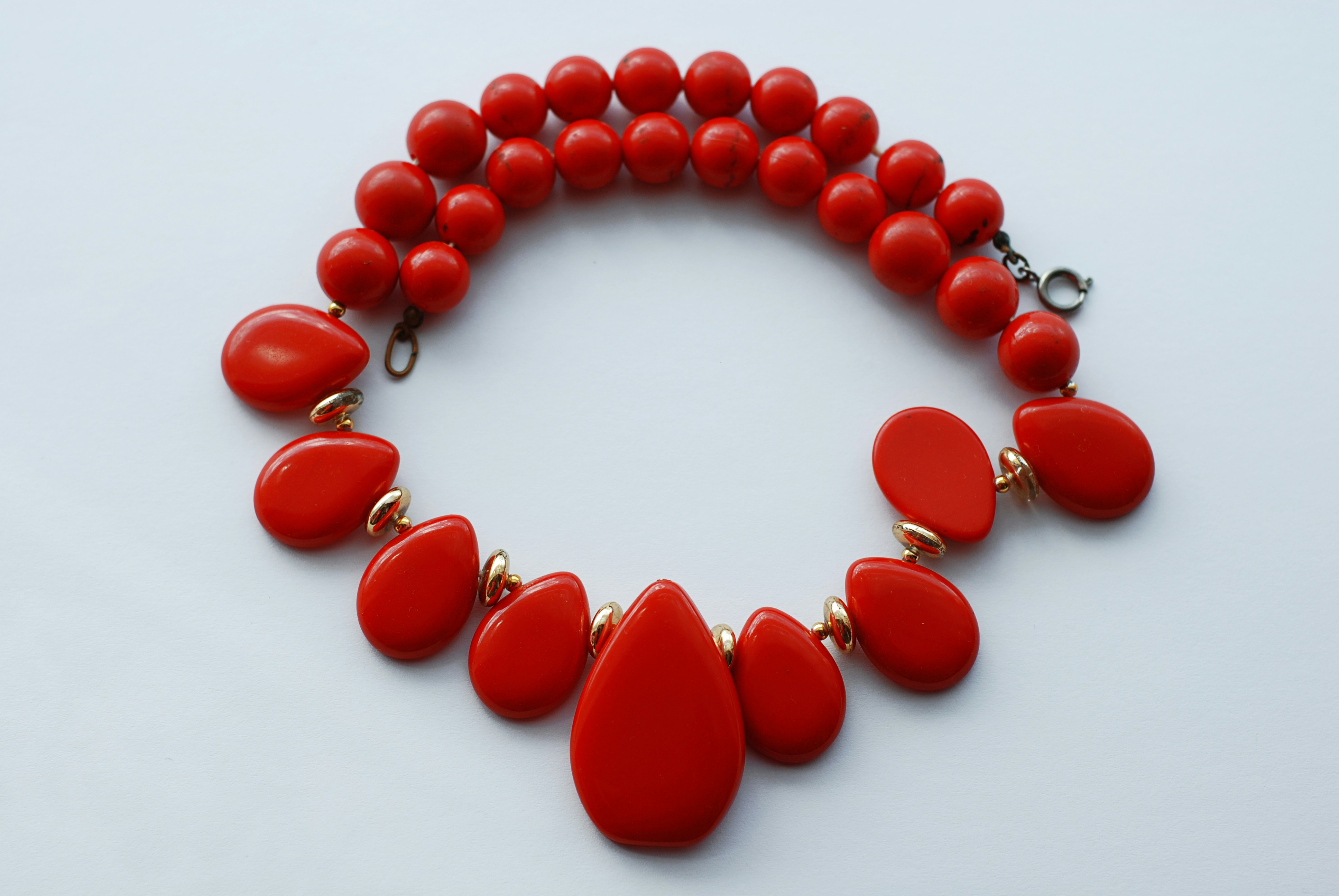 Red Ampersand: A Bold Necklace Unfolding in Studio Light