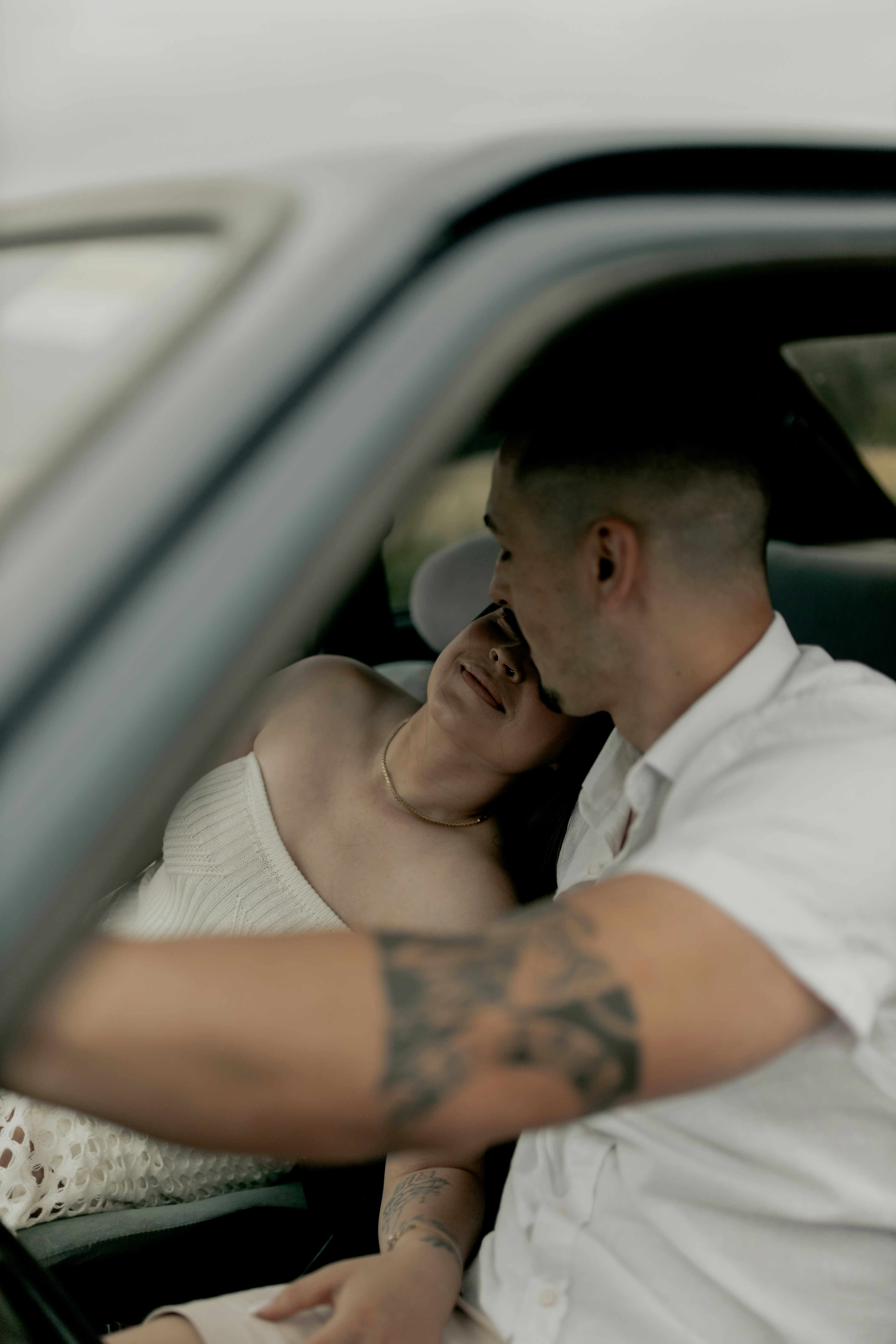 A man sitting in a car talking on a cell phone photo – Free Image on ...