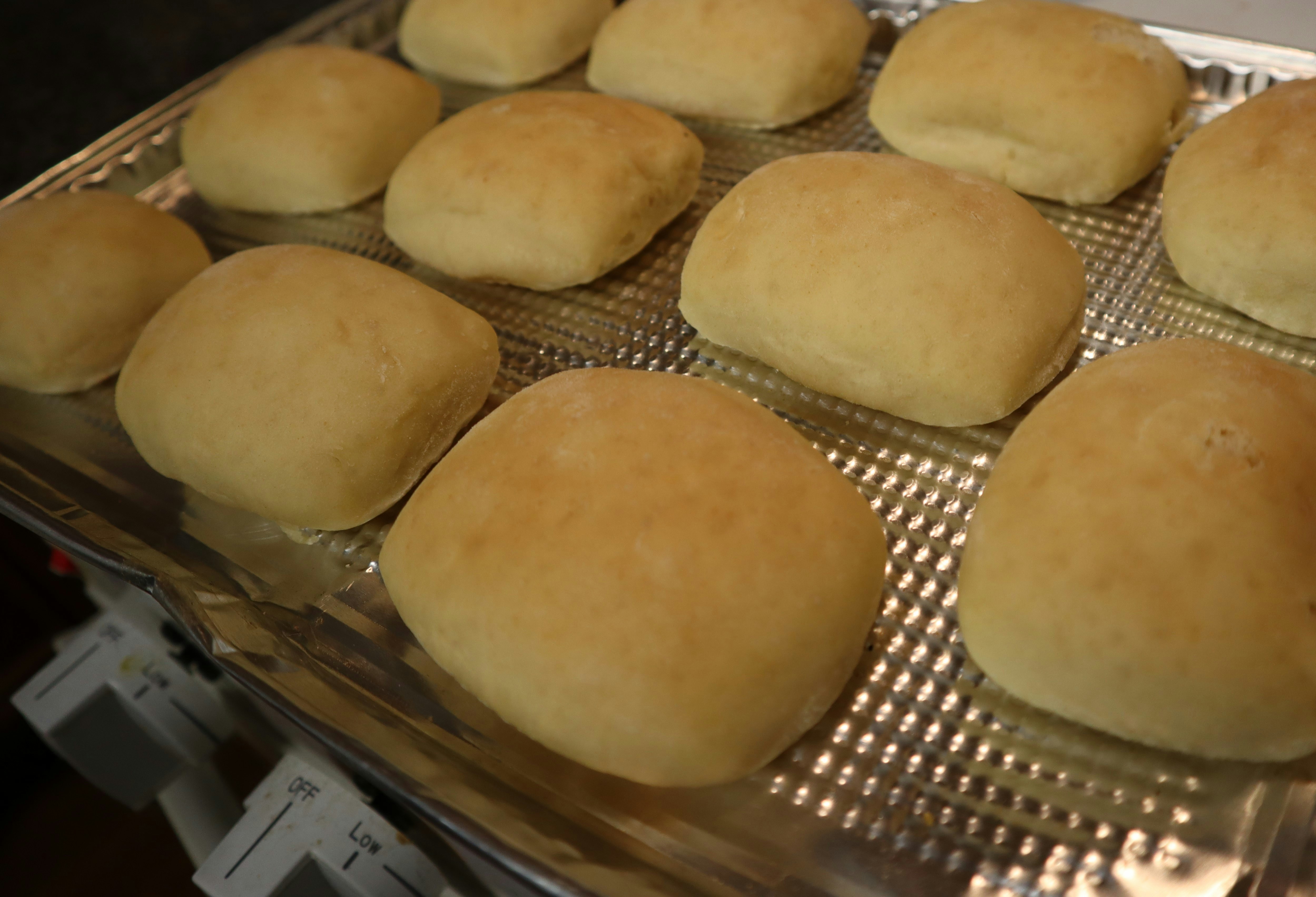 A tray of rolls sitting on top of a counter photo – Free Blaine Image ...