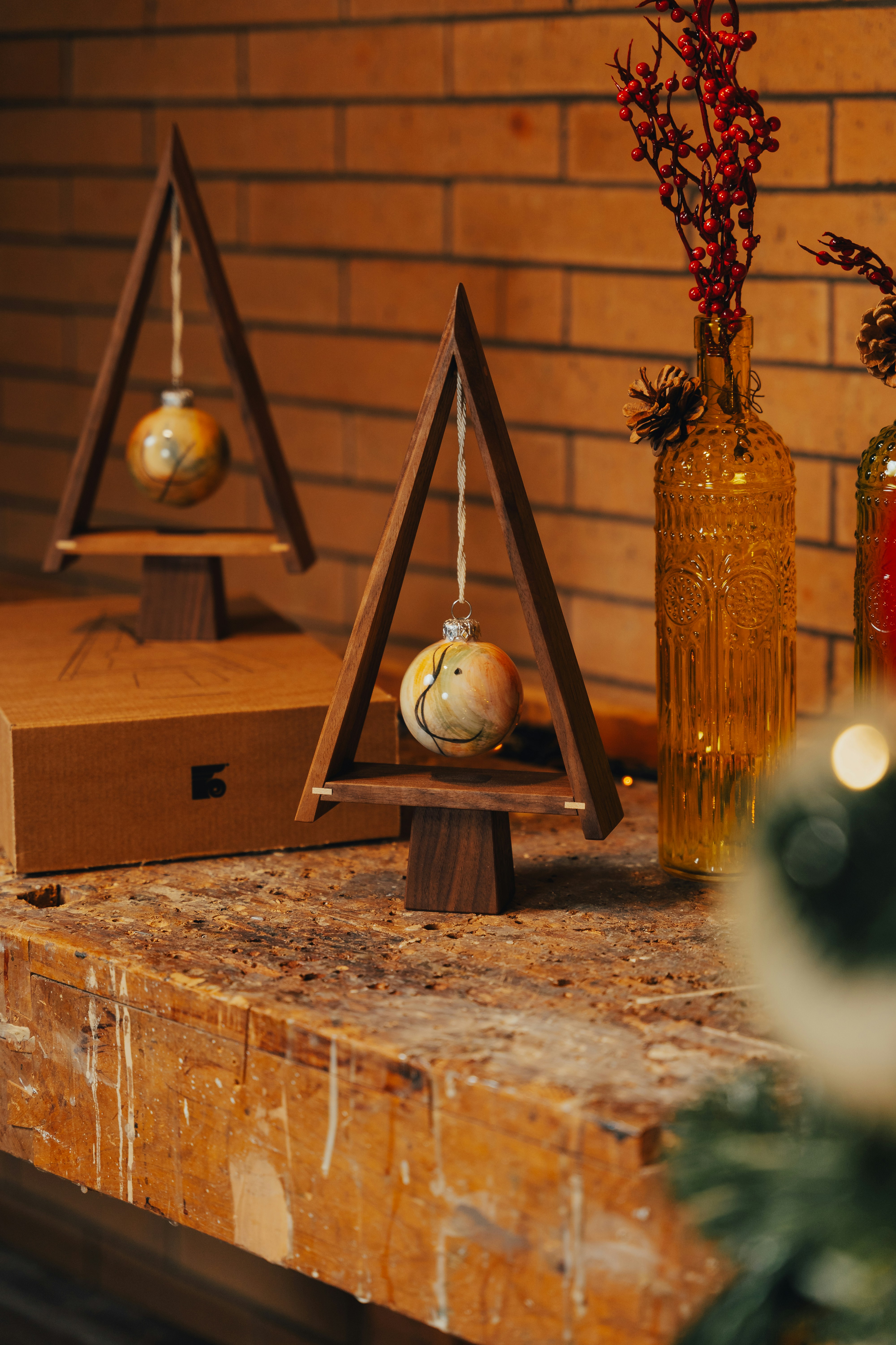 Geometric Ornaments on a Rustic Mantel