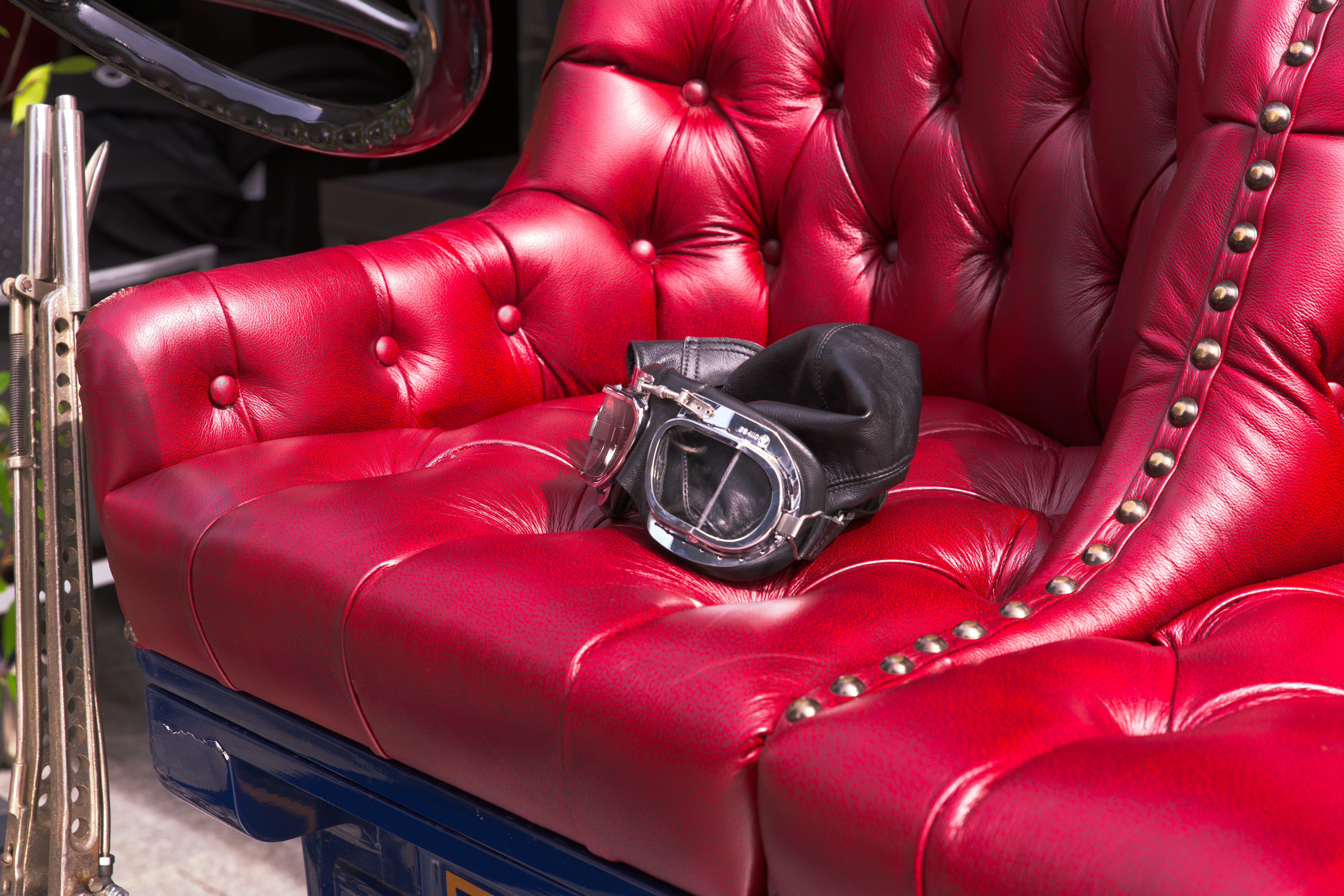 Glistening Red Velvet Seat with Vintage Pilot Gear