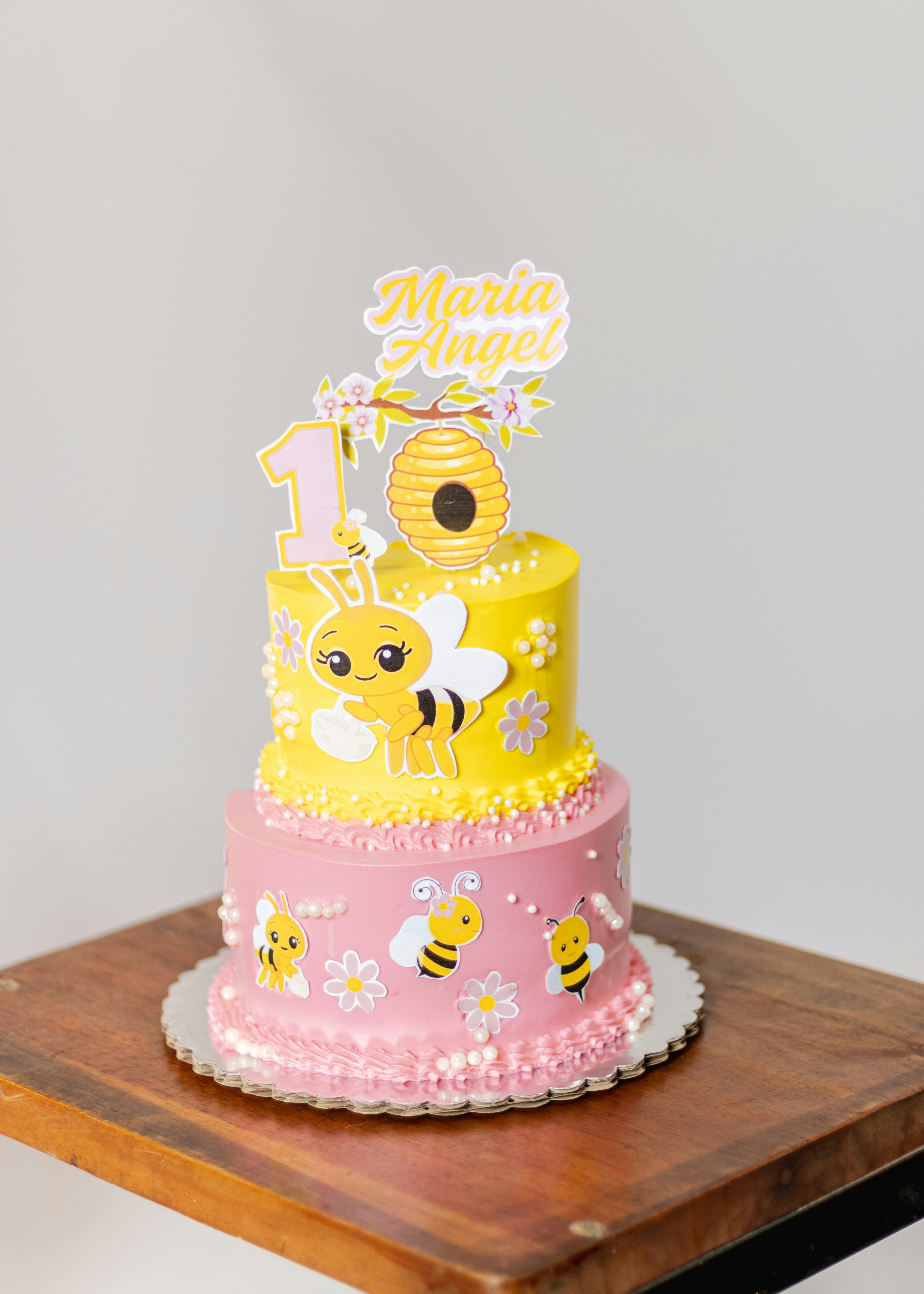 A three tiered cake with a number one on top photo – Free Cake Image on ...