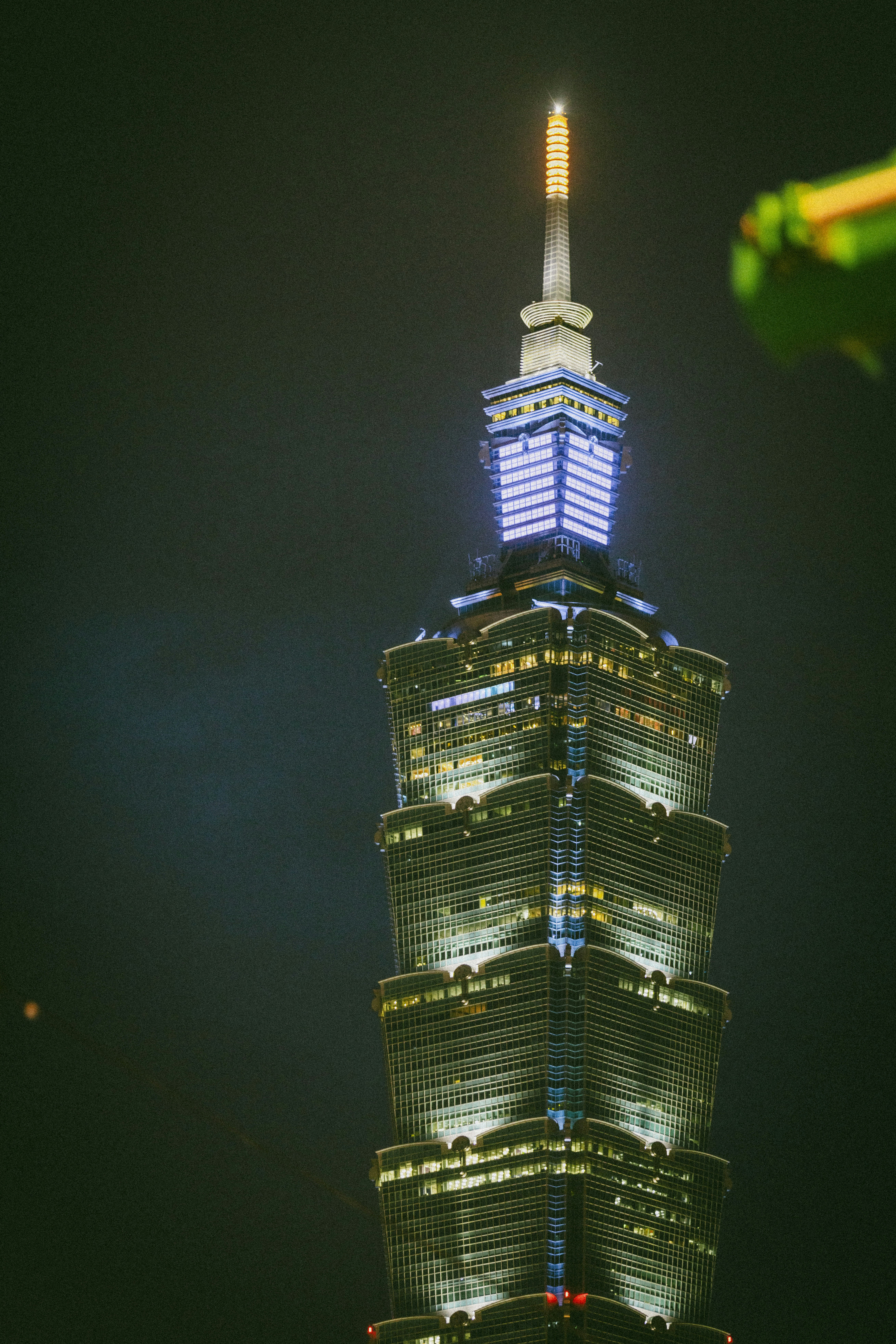 Neon-Tiered Summit: Taipei 101 Pierces the Night