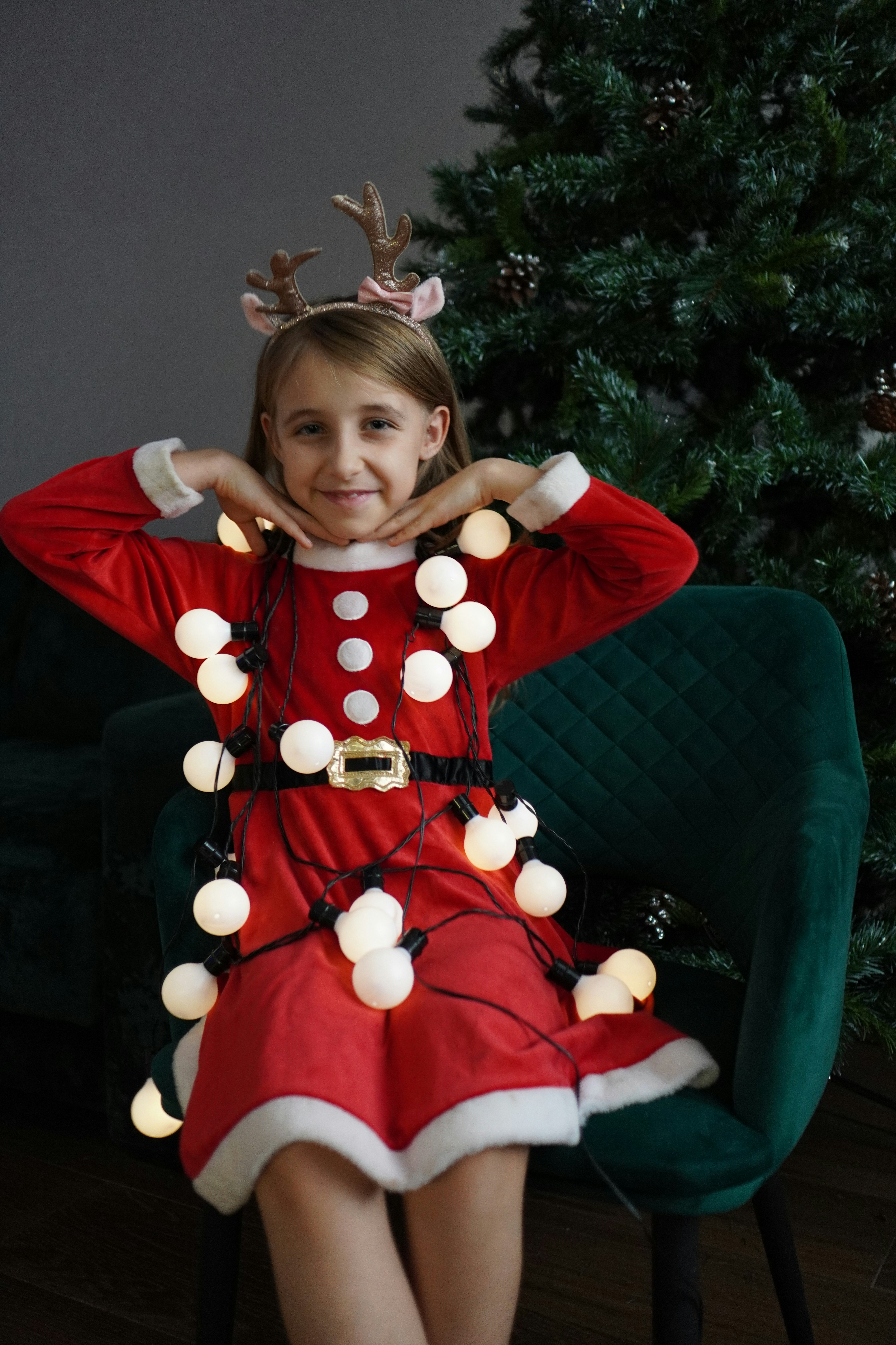 Little Santa, Big Glow: Portrait Under a Sea of Holiday Lights