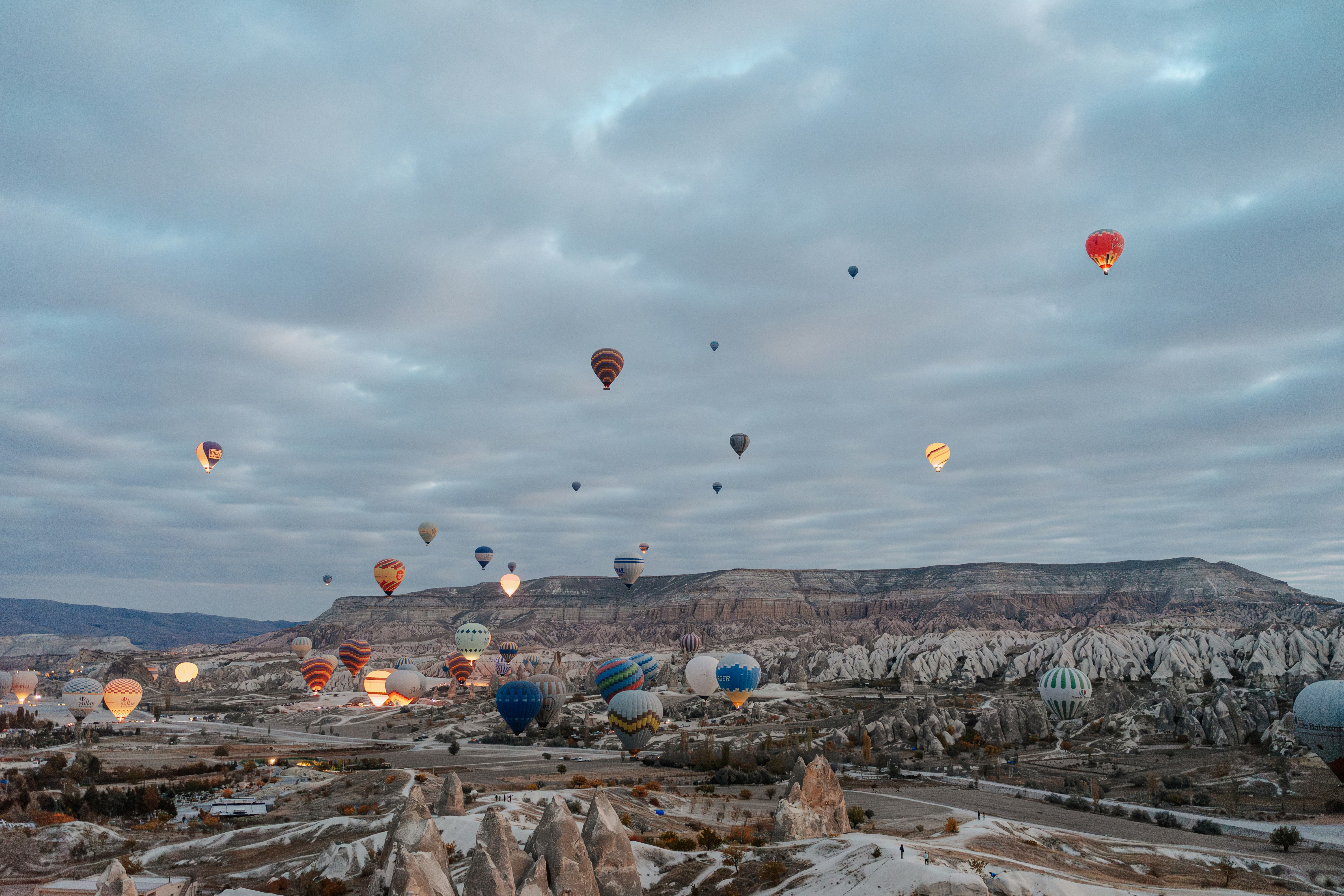A bunch of hot air balloons flying in the sky photo – Free Wallpaper ...