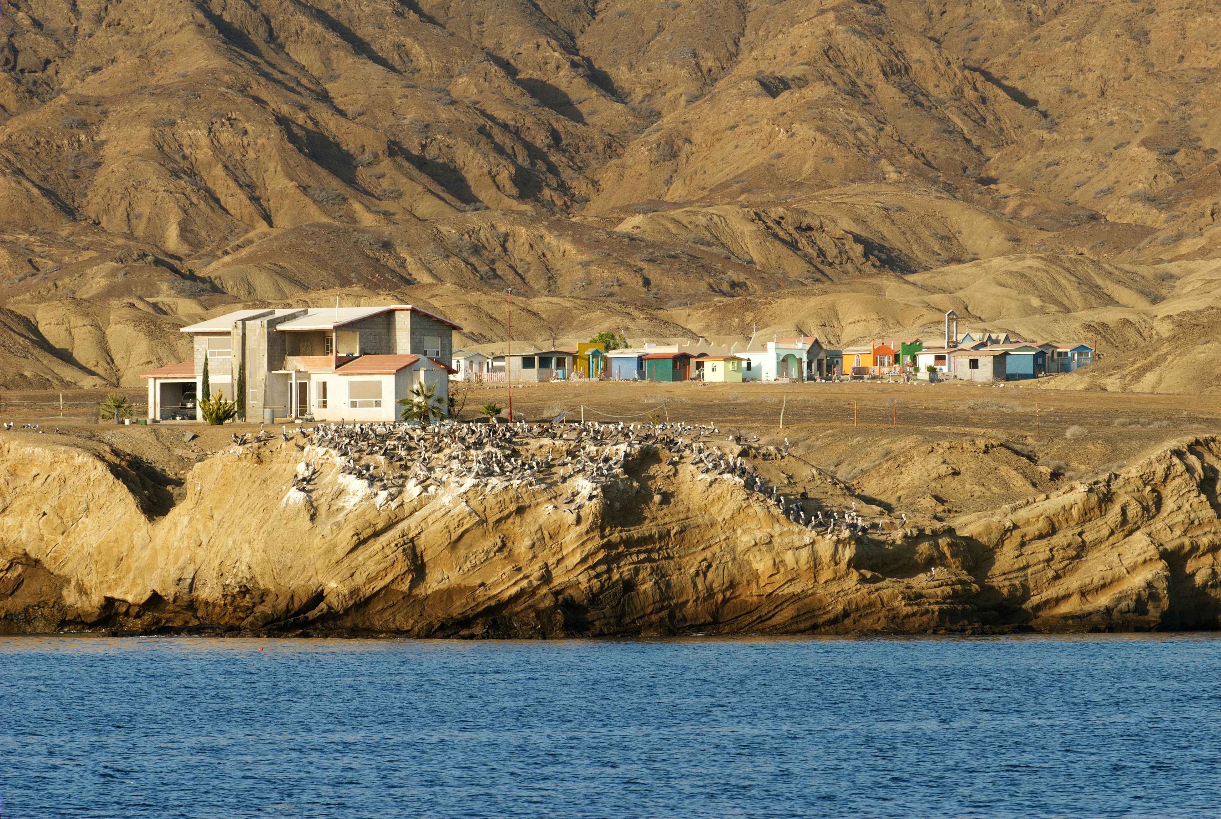 Cliffside Village Under a Winged Chorus