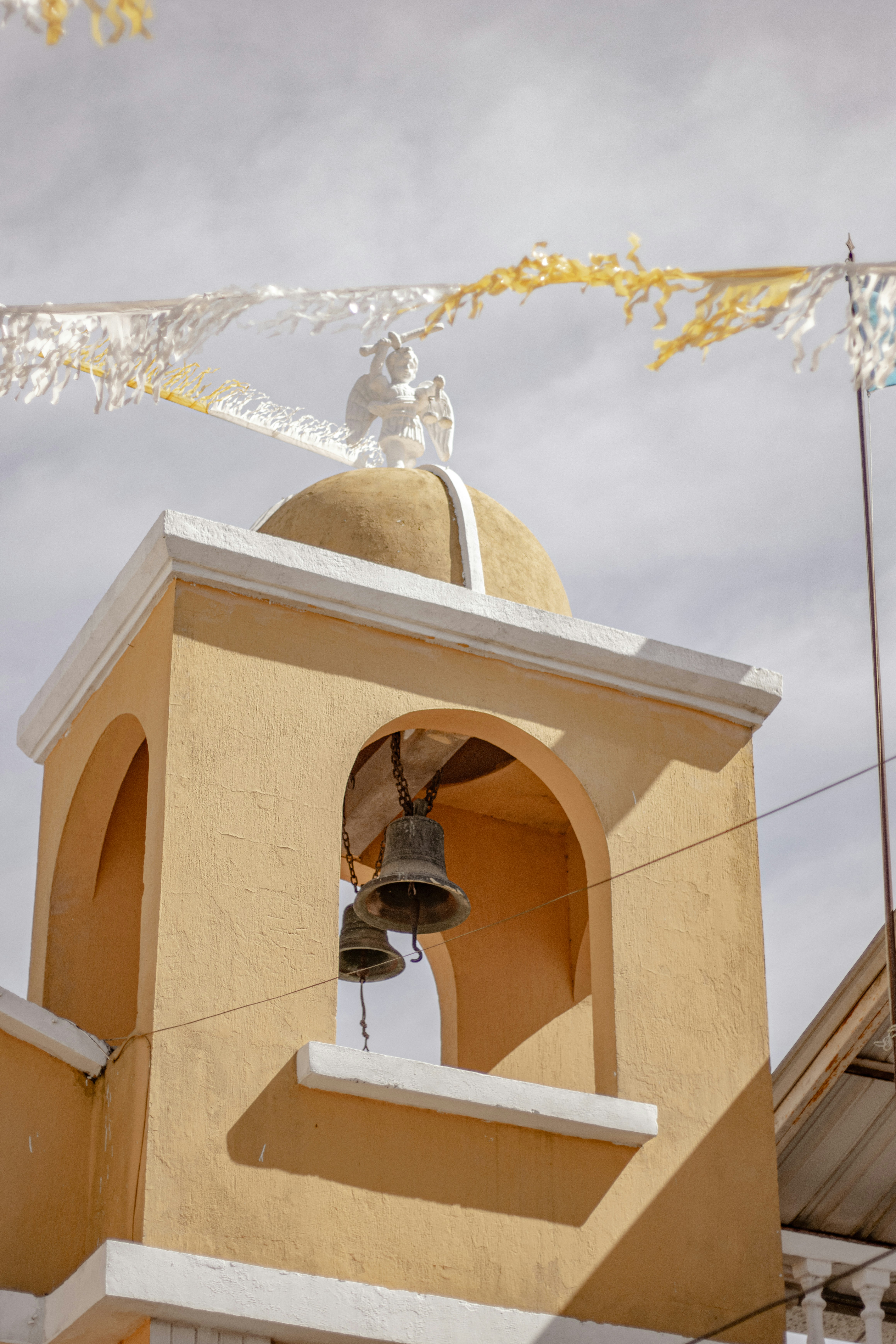 Golden Bell Tower Under a Serene Sky