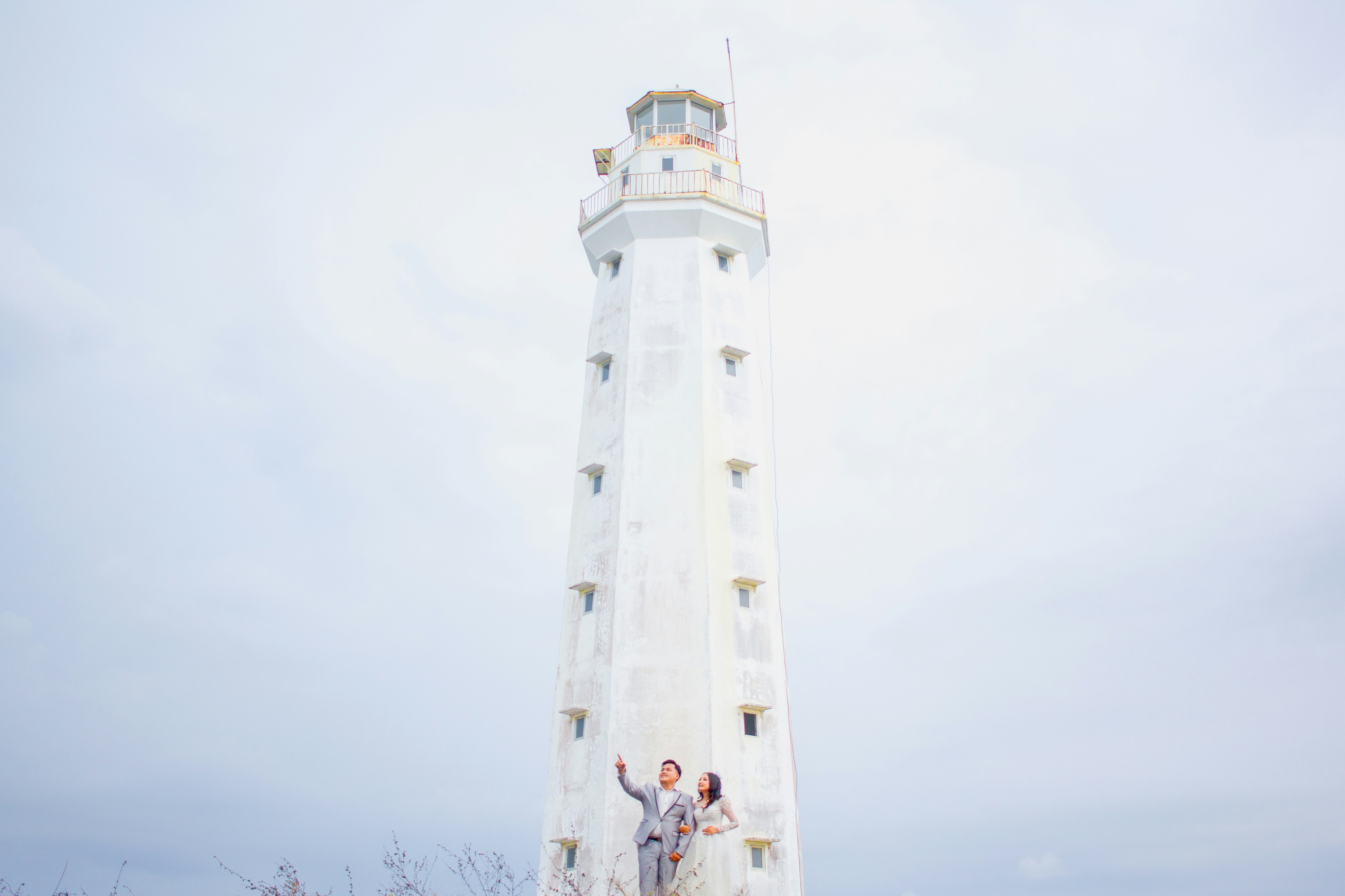 Lighthouse Summit: A Trio at Dusk Cradling the Tower