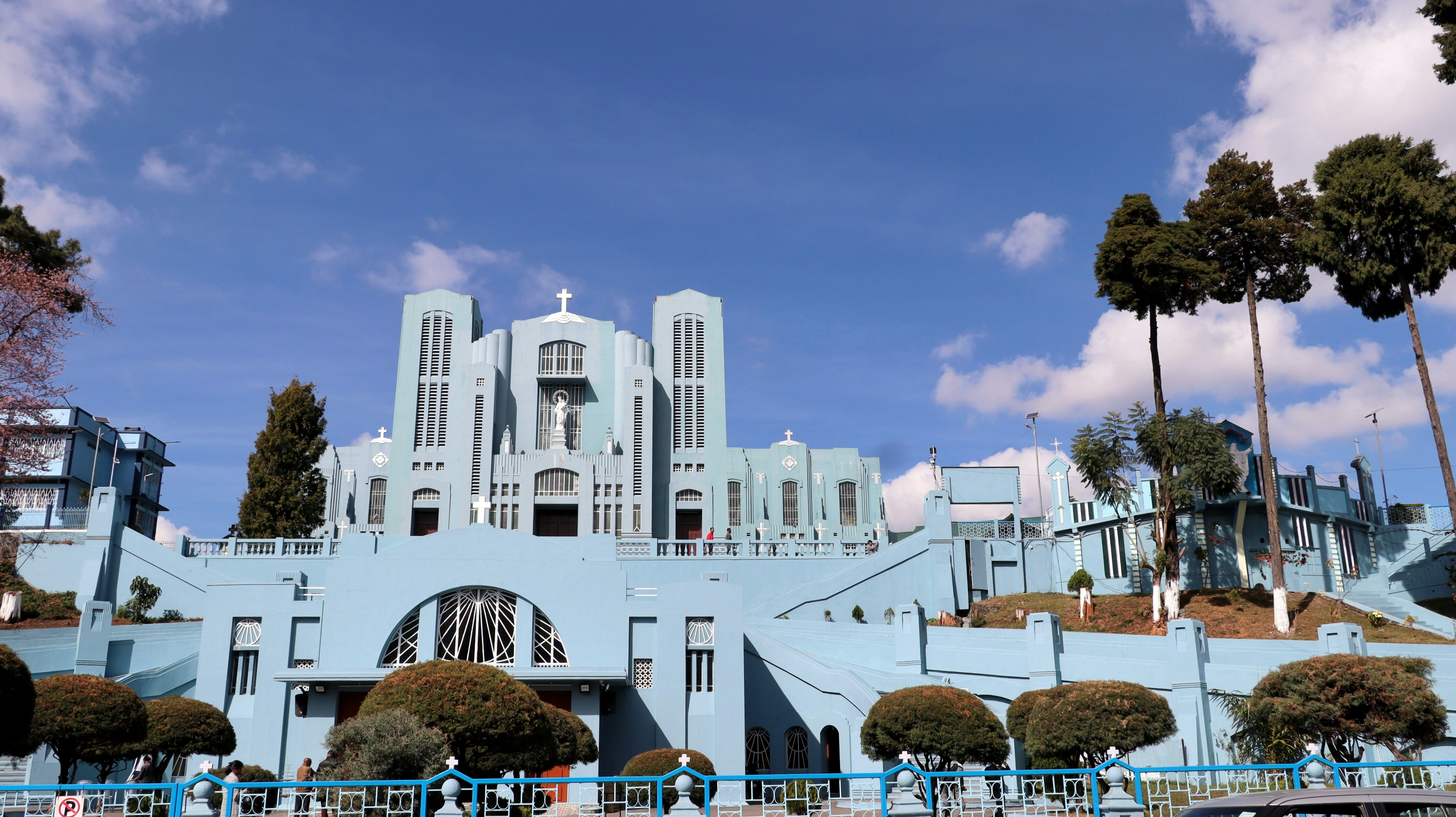 Azure Facade: Symmetry and Stairs of a Blue Church Complex