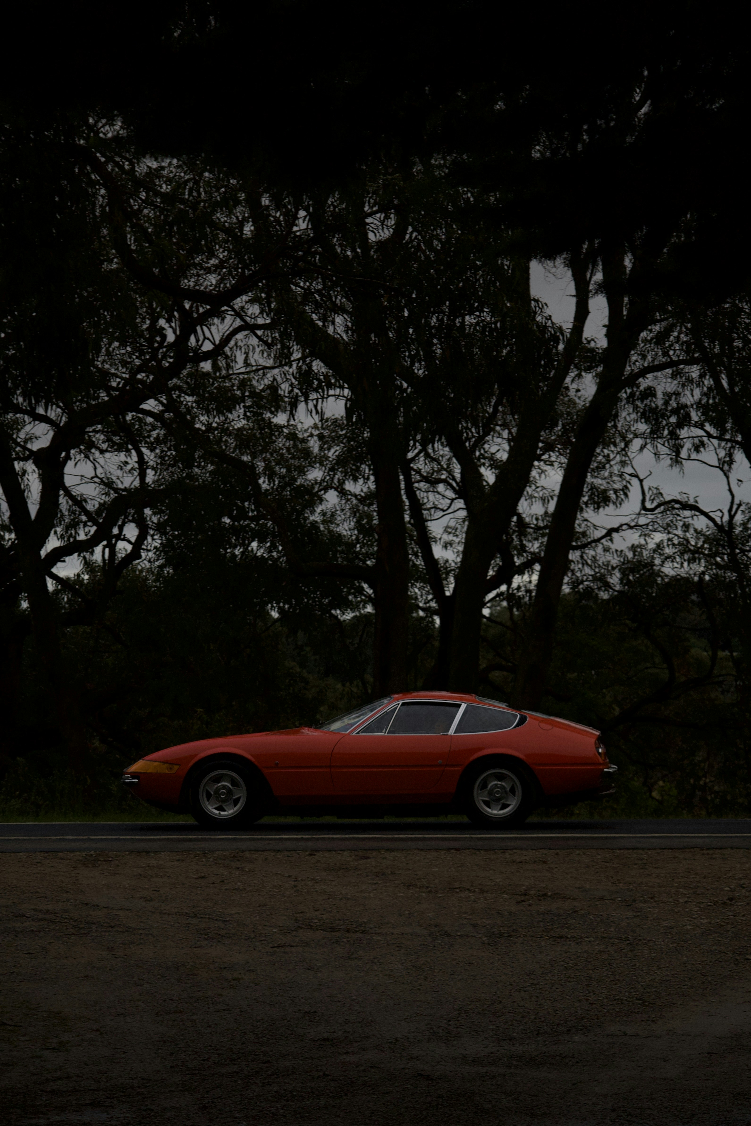 Moonlit Backroad Red: A Vintage Coupe in Quiet Shadow