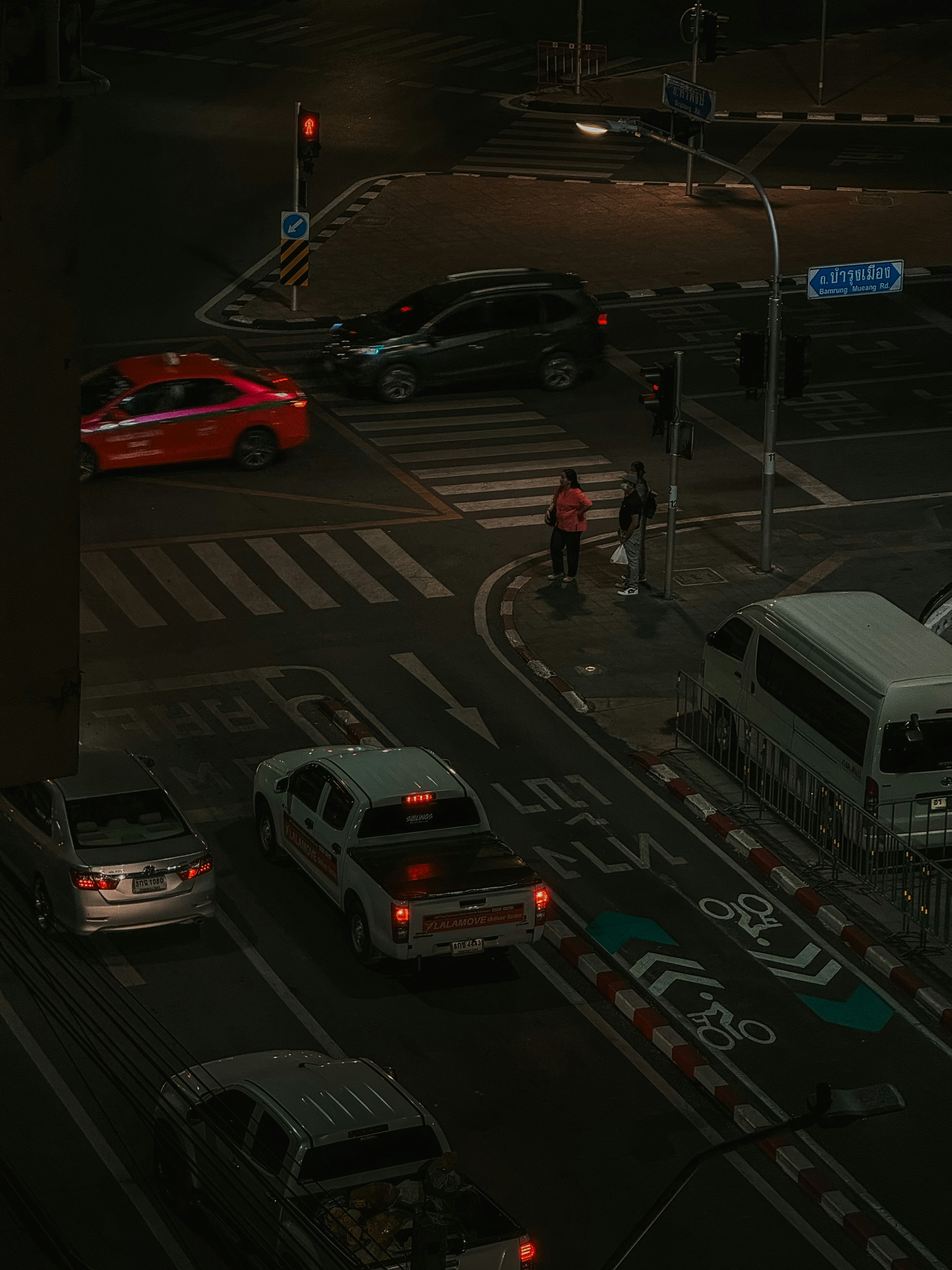 Night Crossing: A Quiet Intersection Under Streetlight Veil