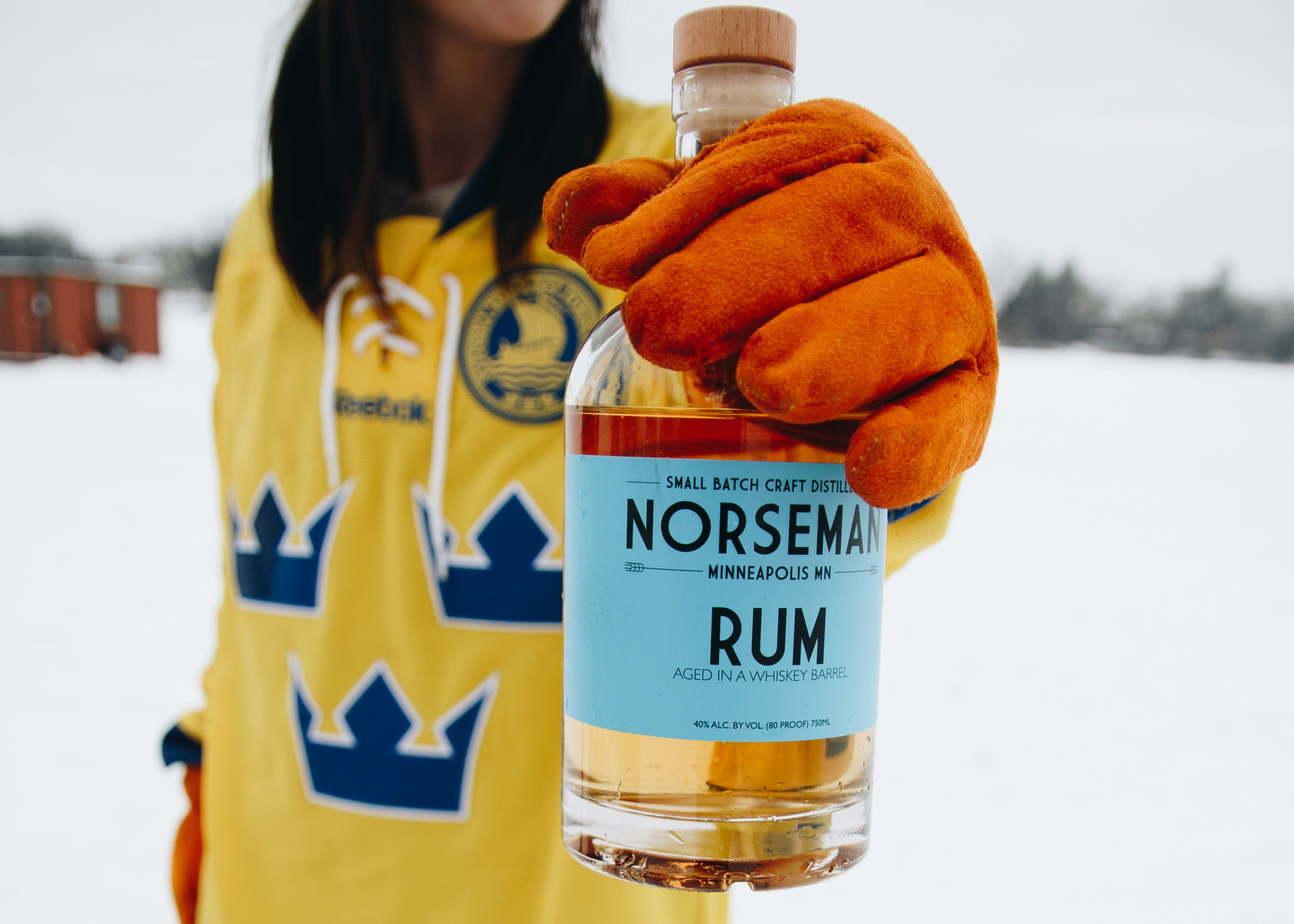 Amber in Winter Light: Norseman Rum Bottle in Snowy Quiet