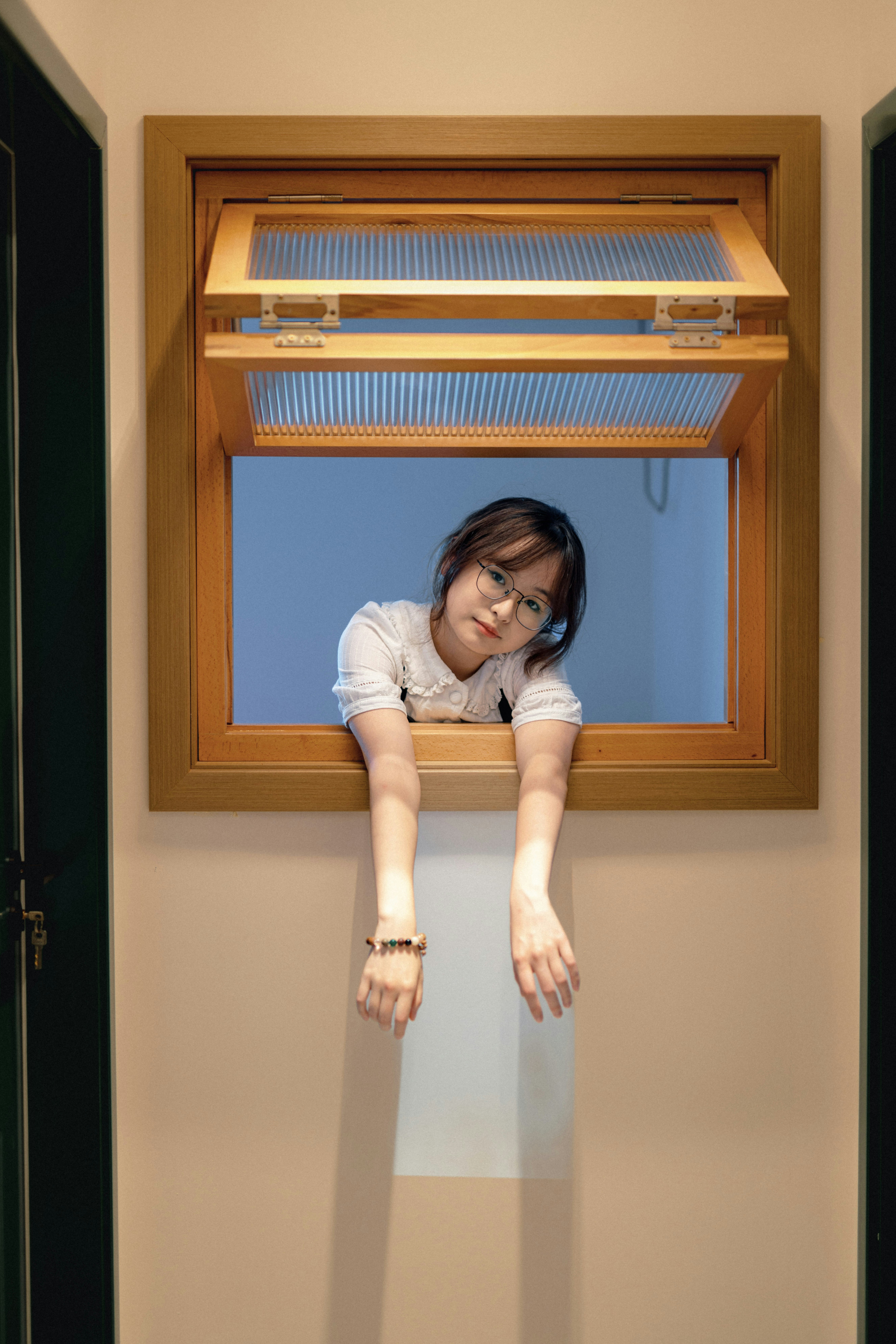 Window Gaze: A Portrait Emerging from the Wood Frame