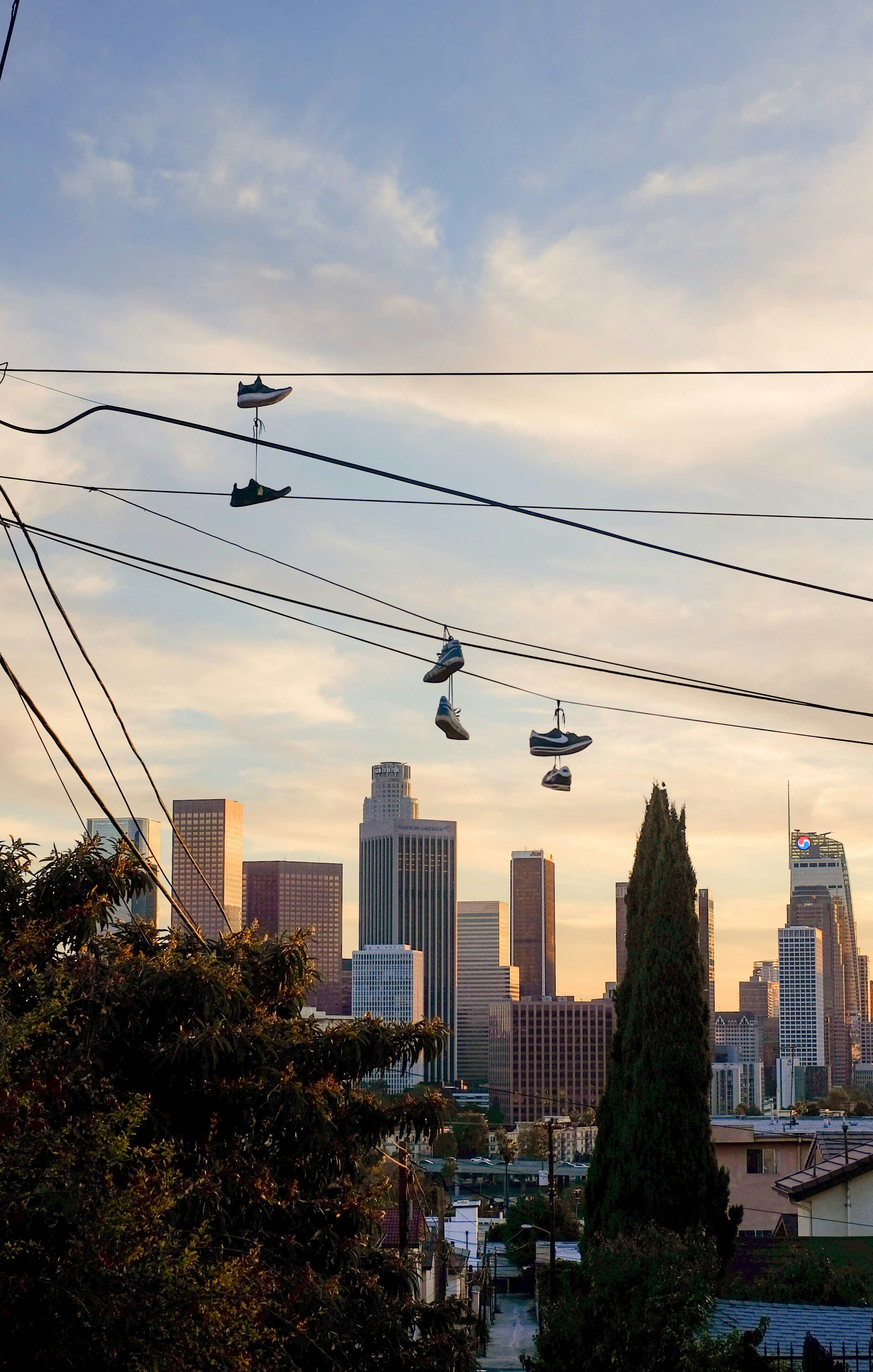 Shoe Line Over Sunset Skyline: A Quiet Cable Ballet Above Downtown