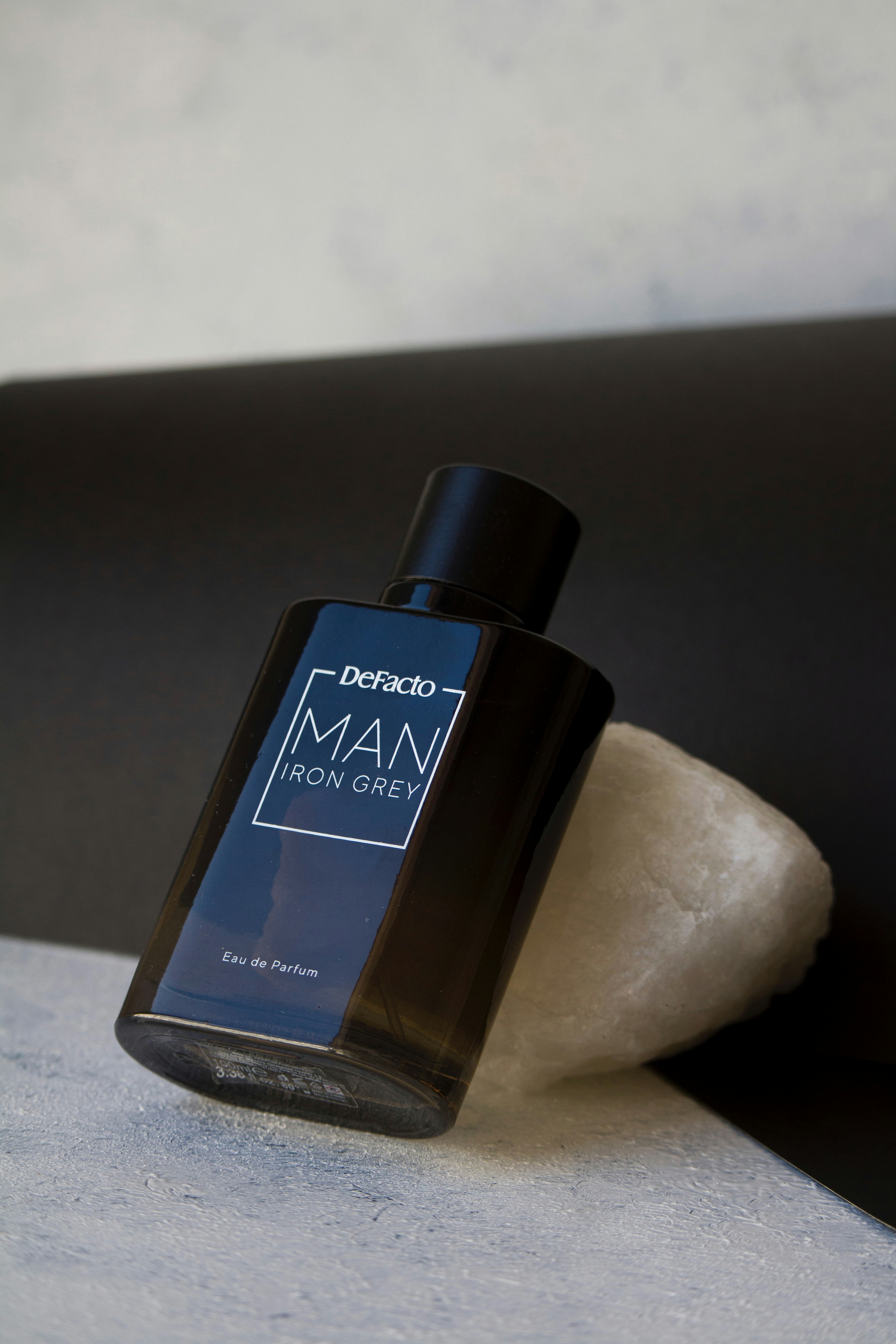 A bottle of cologne sitting on top of a table photo – Free Perfume ...