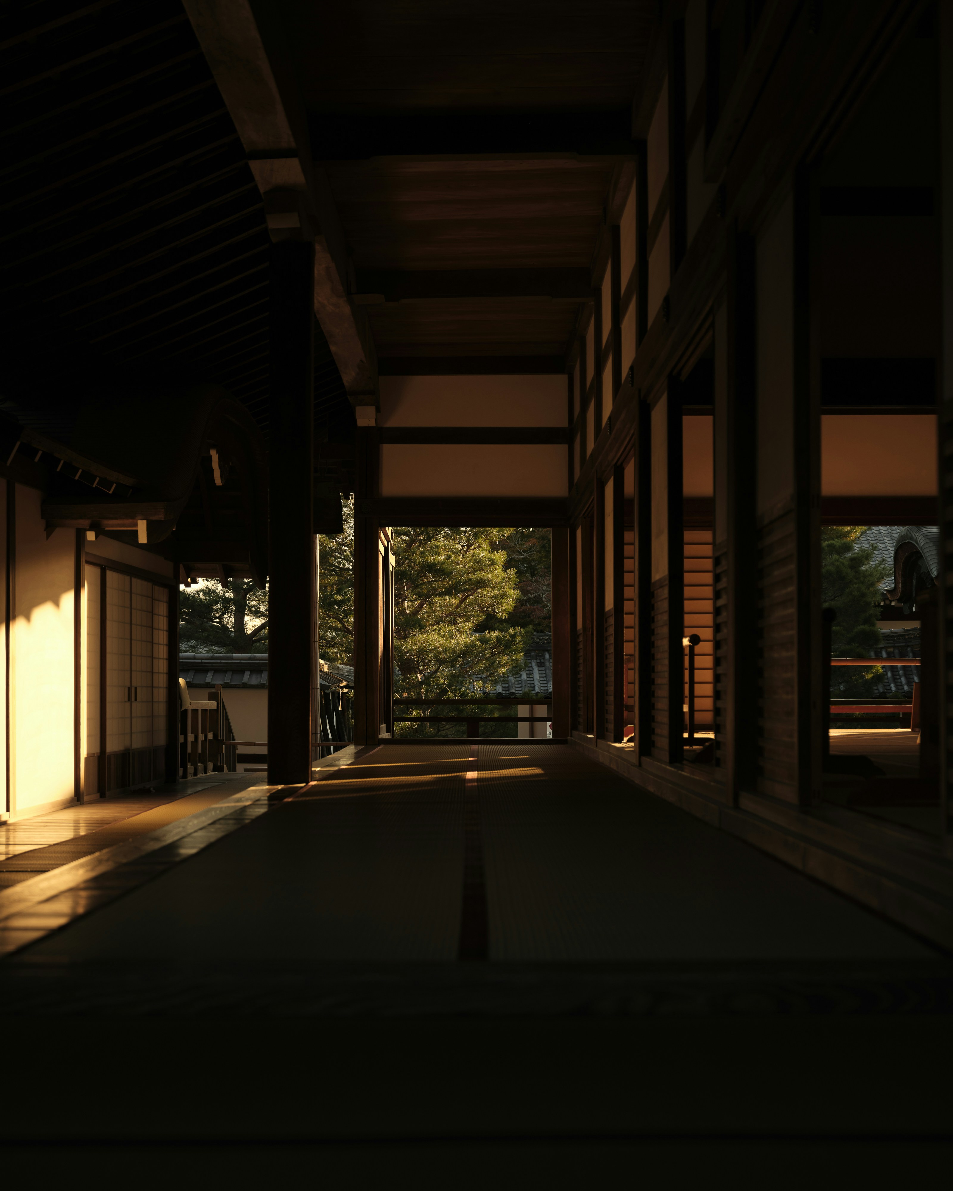A dimly lit hallway leading to a balcony photo – Free Building Image on ...