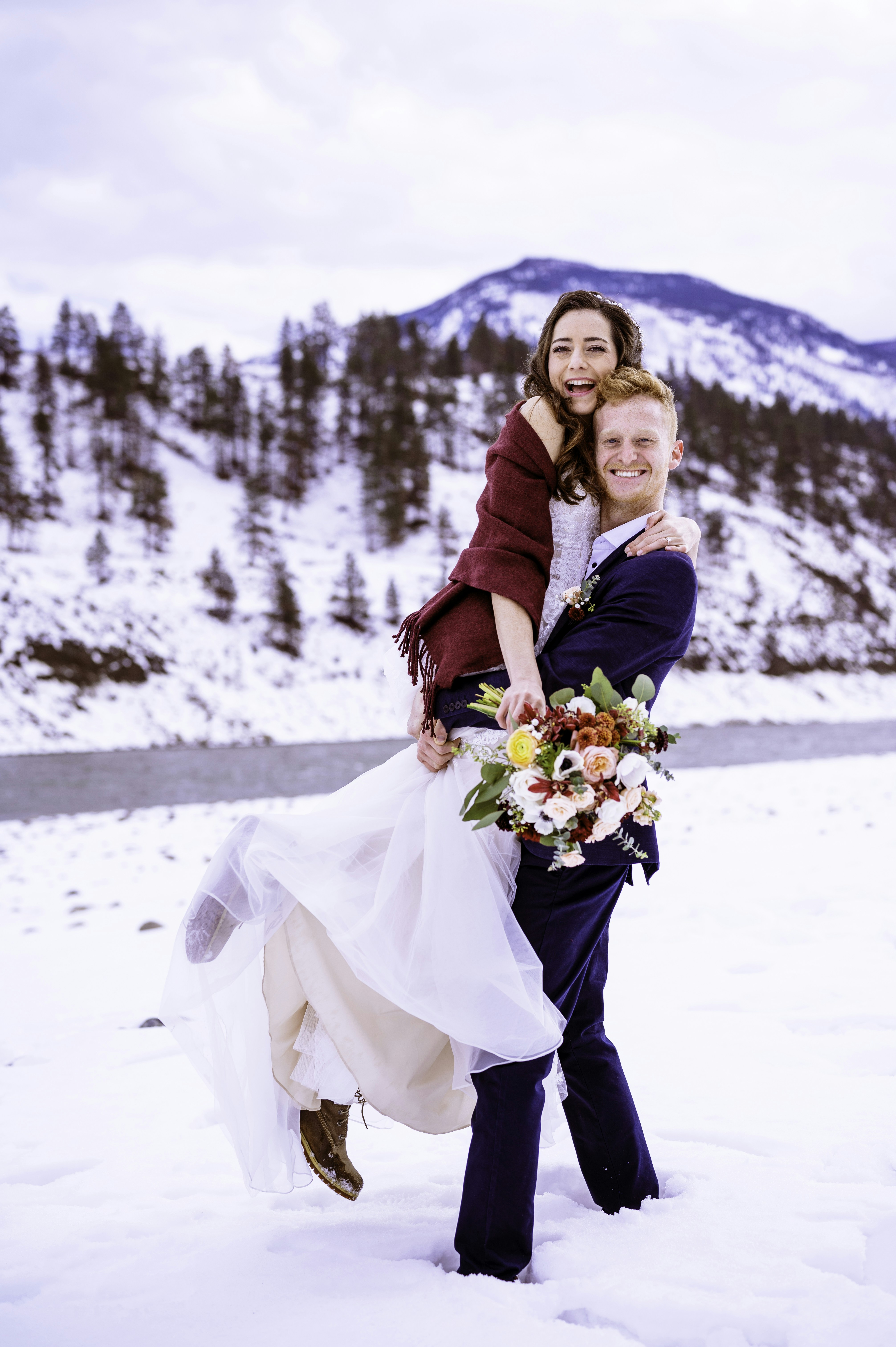 Snowy Embrace: A Bride and Groom Share a Lift in Winter paradise