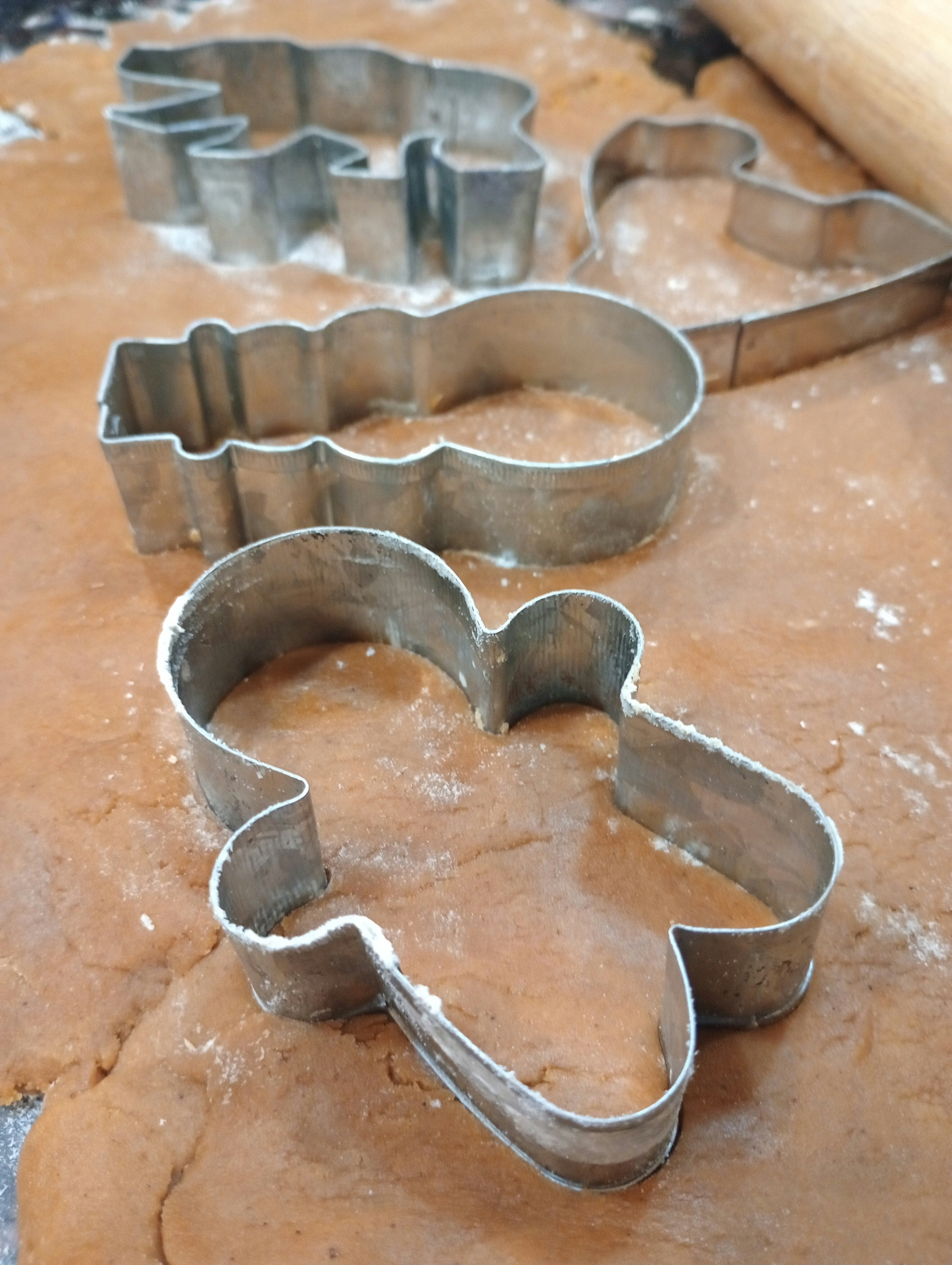 A cookie cutter and cookie molds on a table photo – Free Weapon Image ...