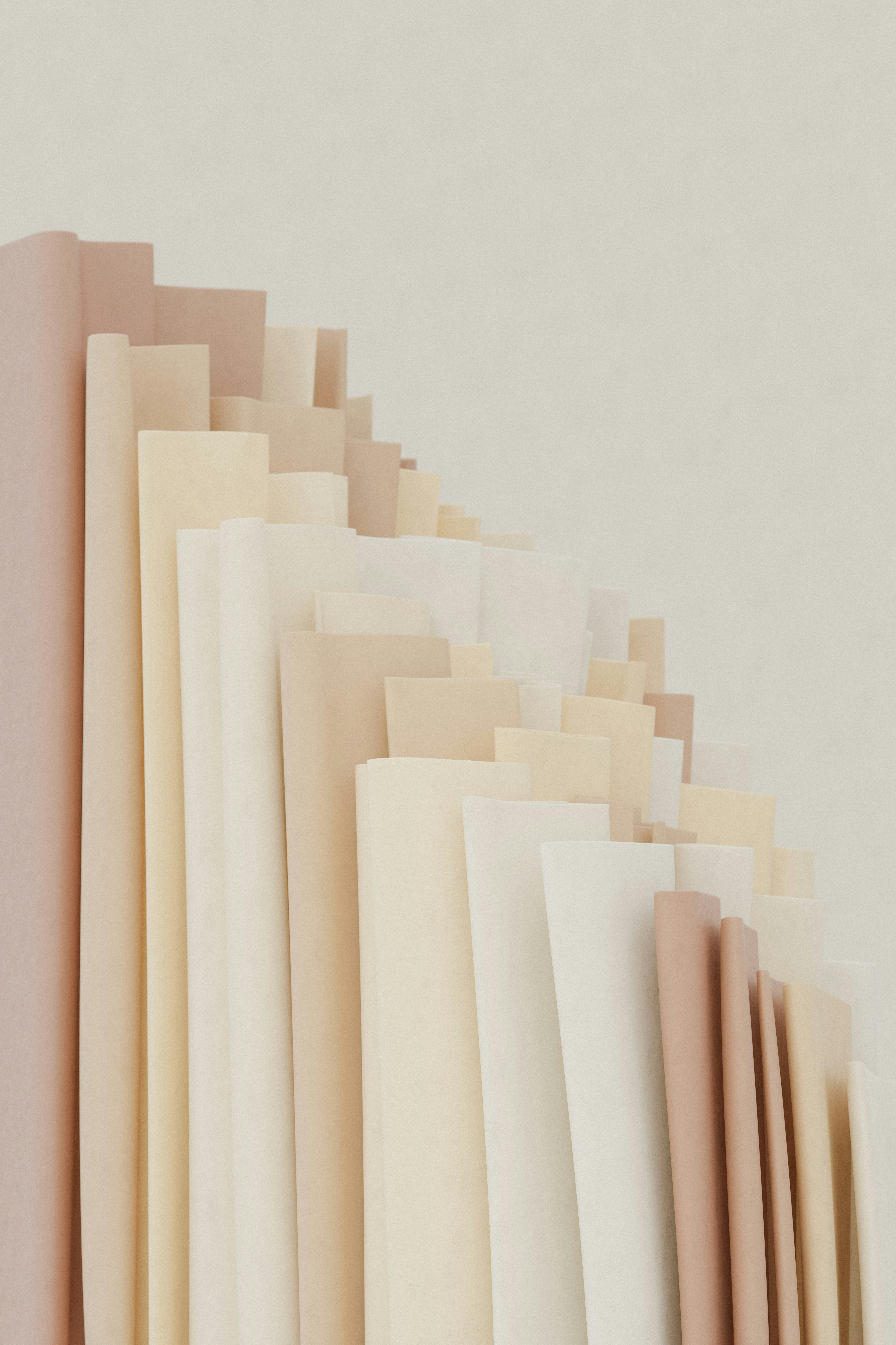 A bunch of different colored papers on a table photo – Free Orange ...