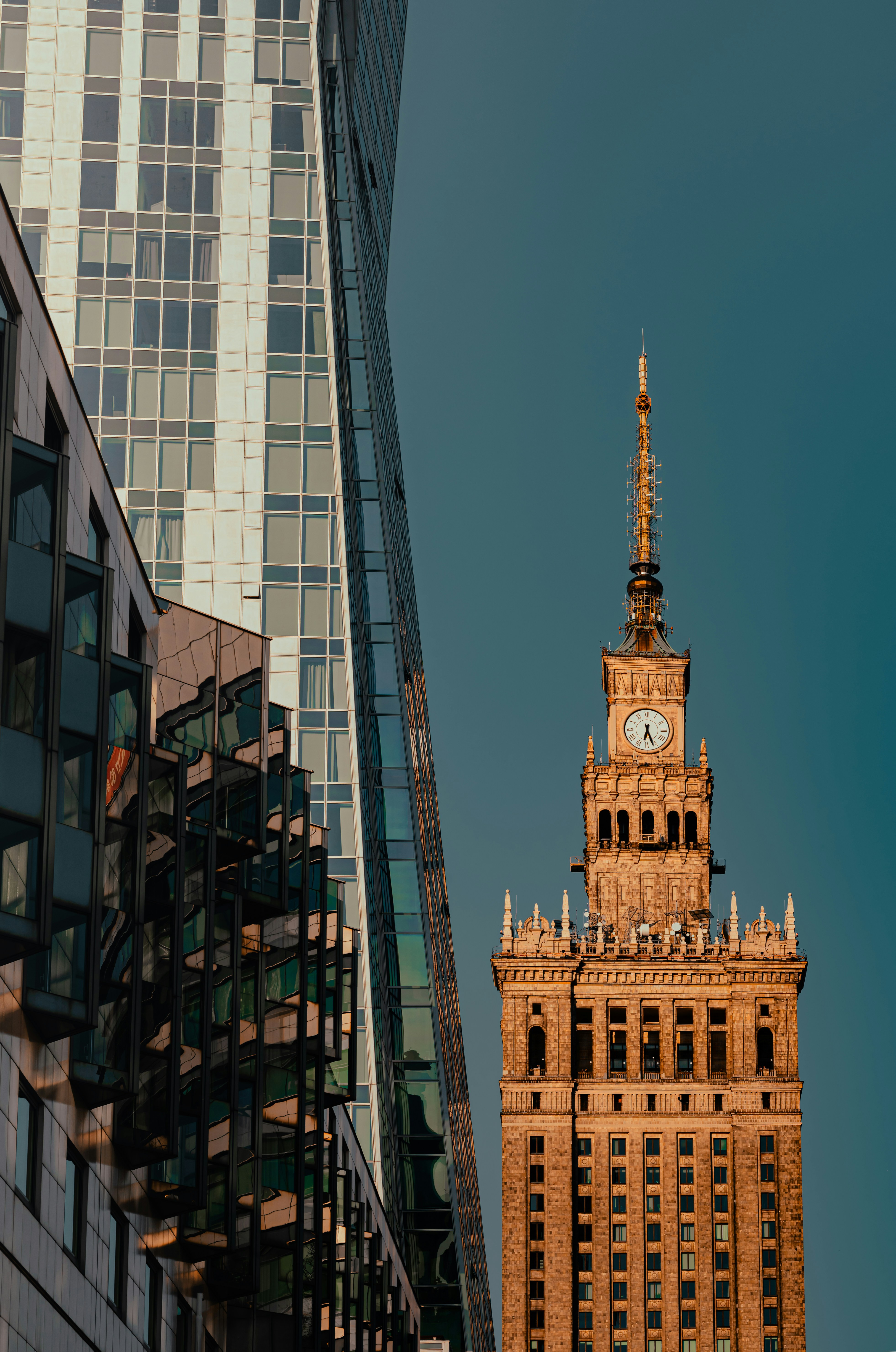 Sunlit Spire Against Glass: Urban Juxtaposition