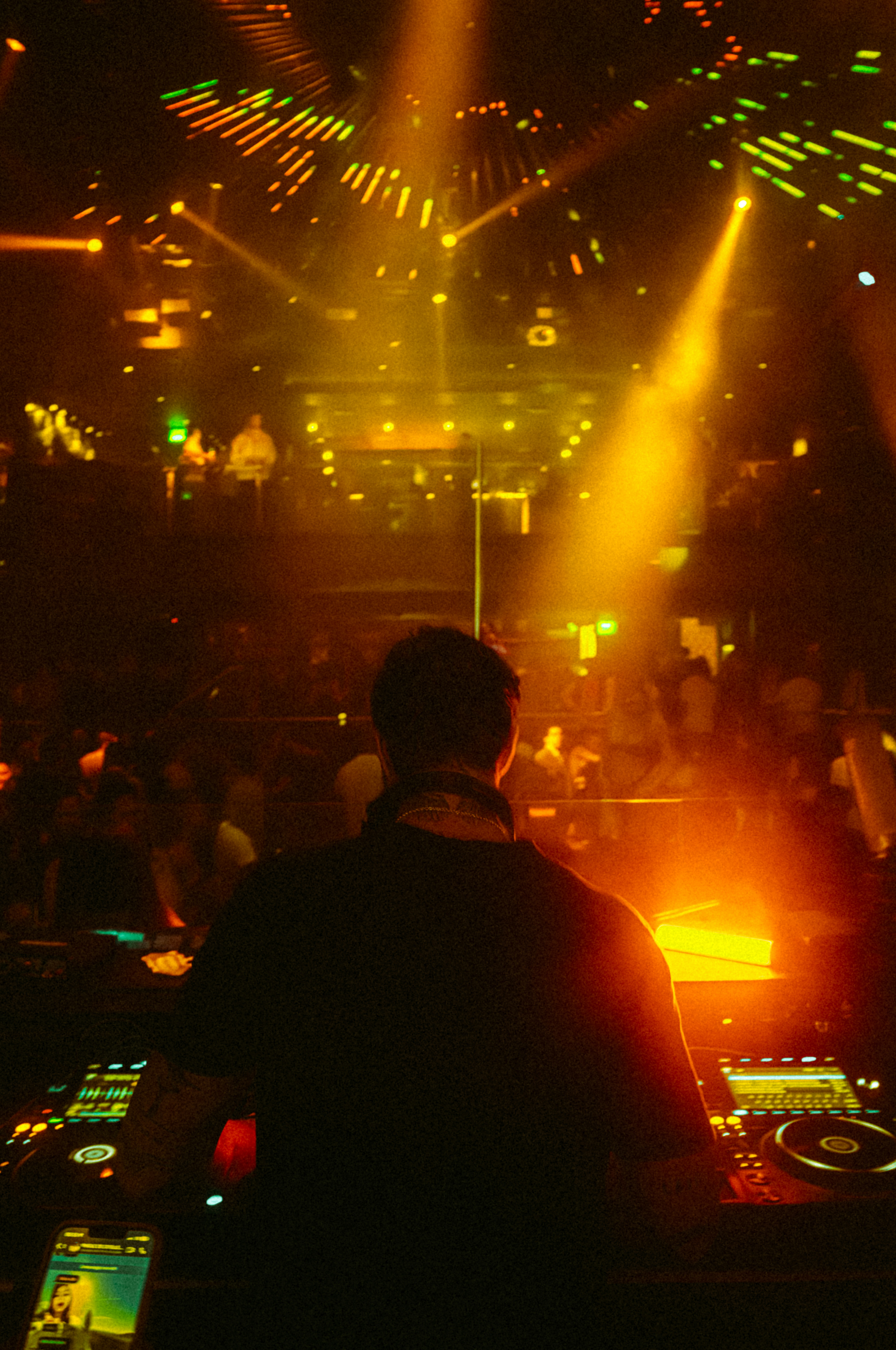 A dj mixing in front of a crowd at a concert photo – Free Woman Image ...