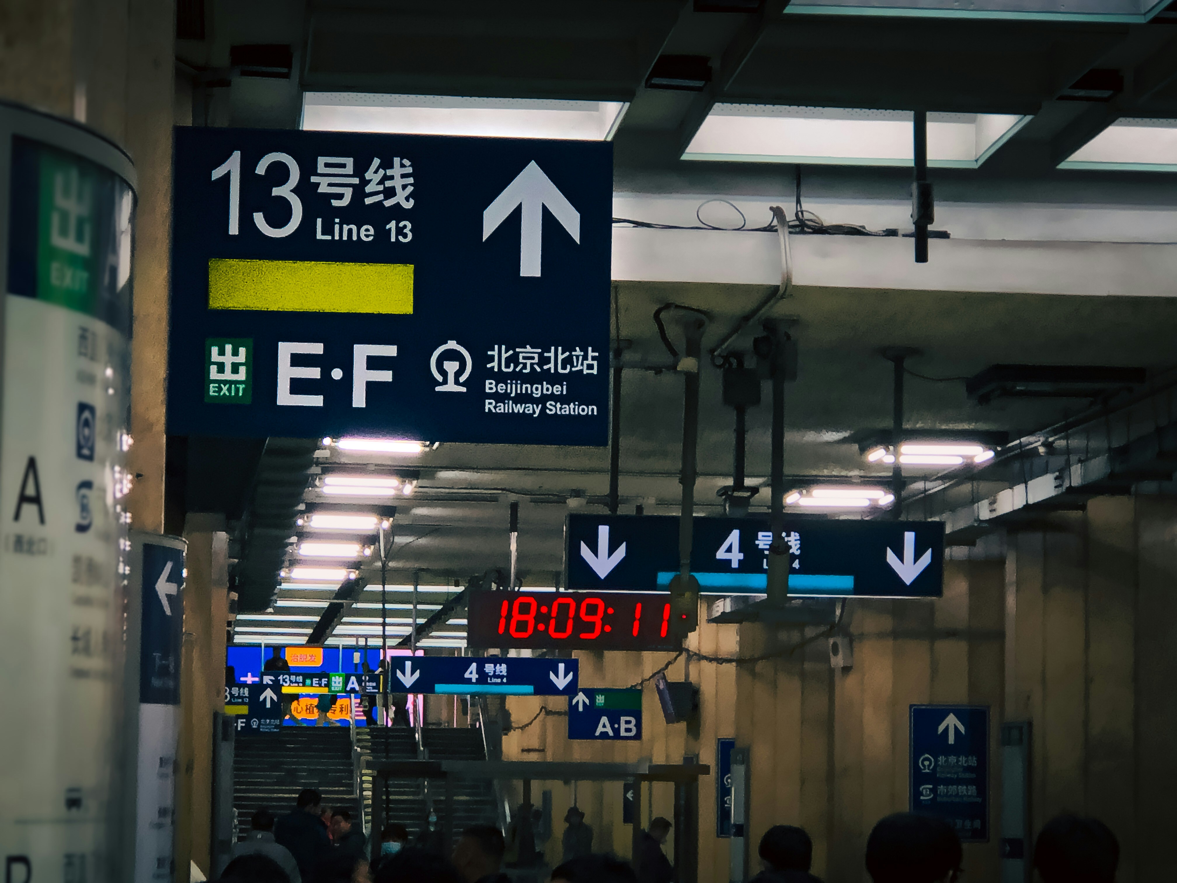 Beijing Northbound: Signage and Timetable in a Quiet Subway Corridor
