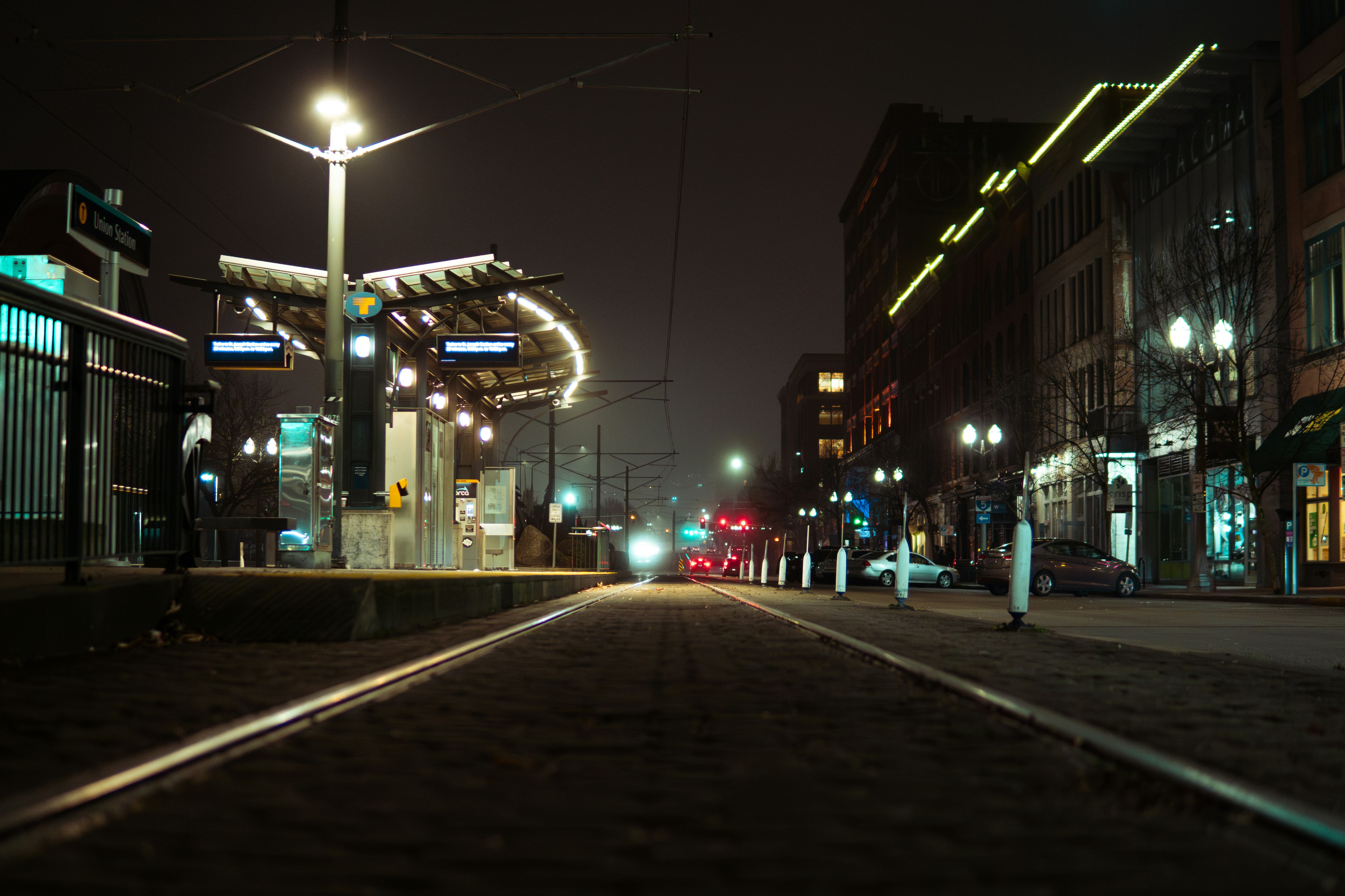 A city street at night with street lights photo – Free Street ...