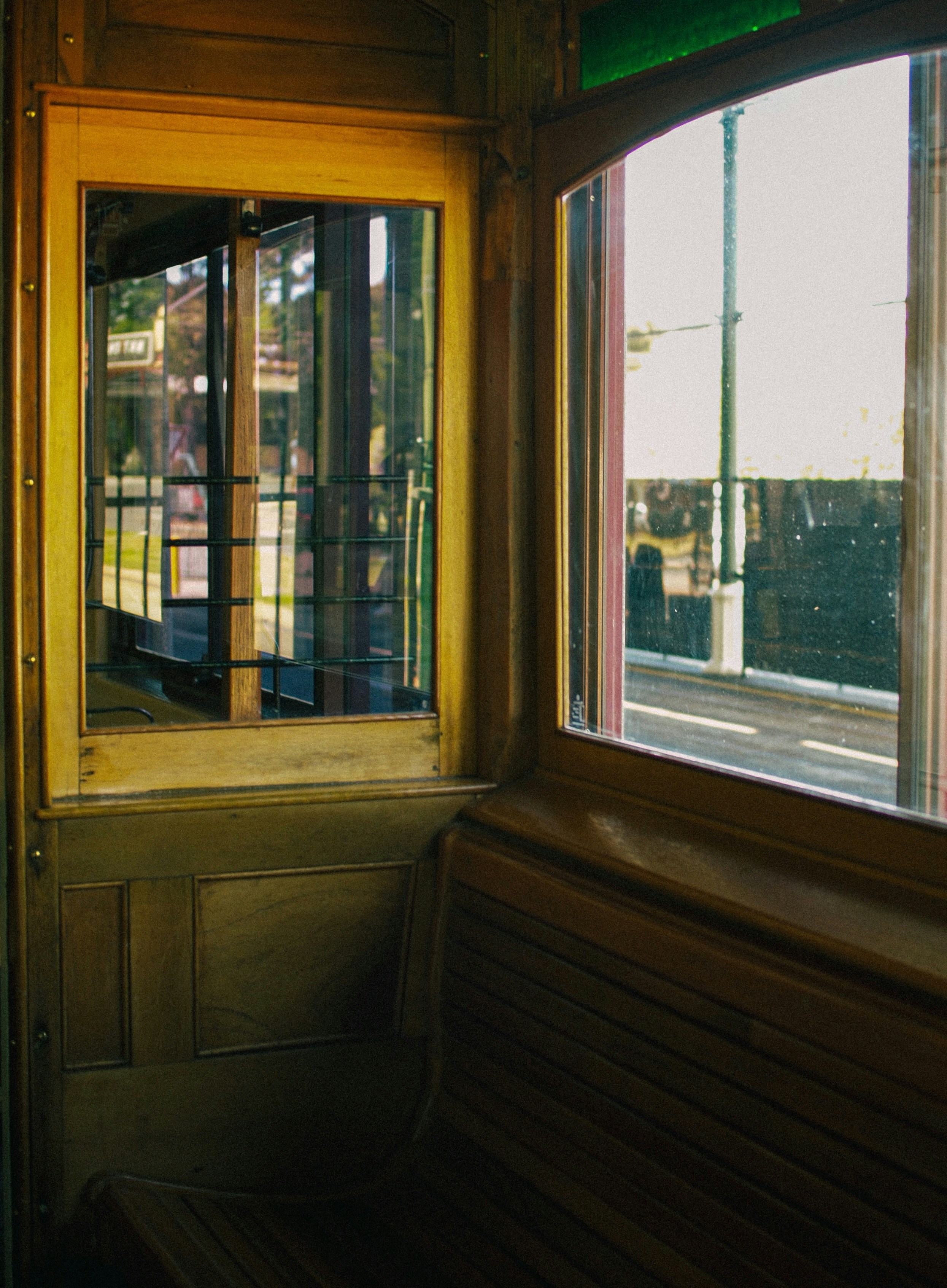 A window in a train car looking out at the street photo – Free ...