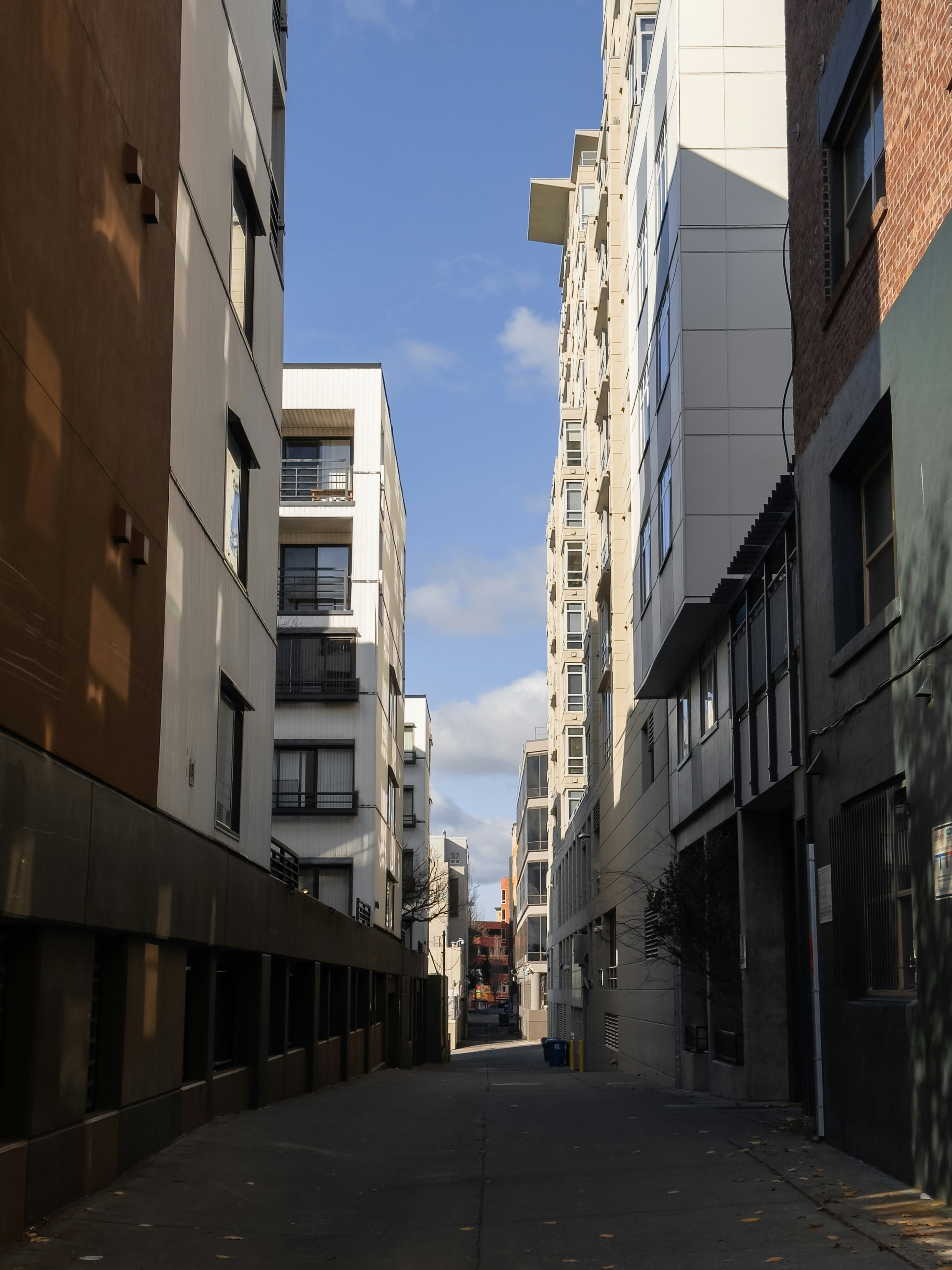 seattle alleyway daytime | A narrow city street lined with tall buildings