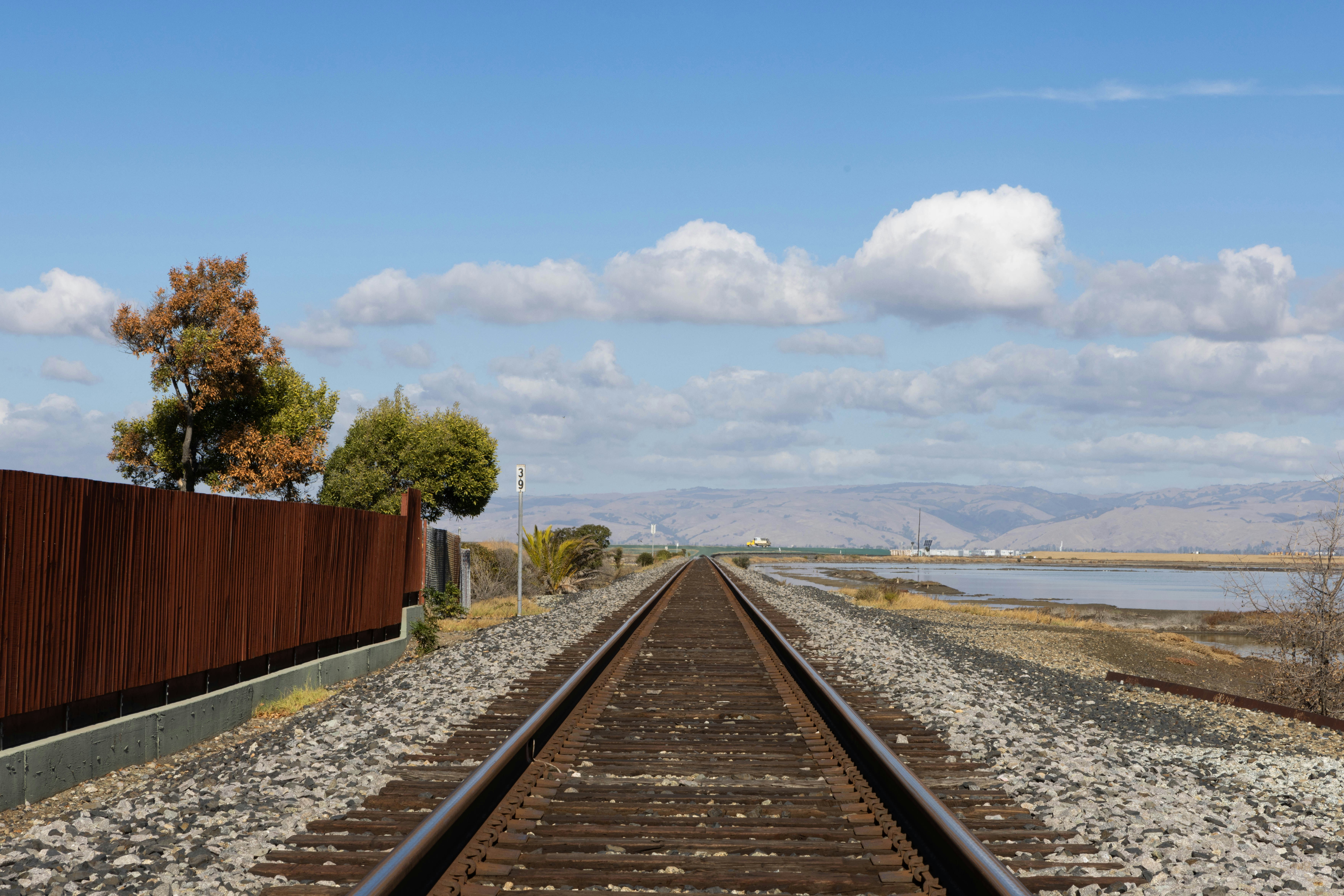 Rails to the Quiet Horizon: A Lonely Track Toward Distant Mountains