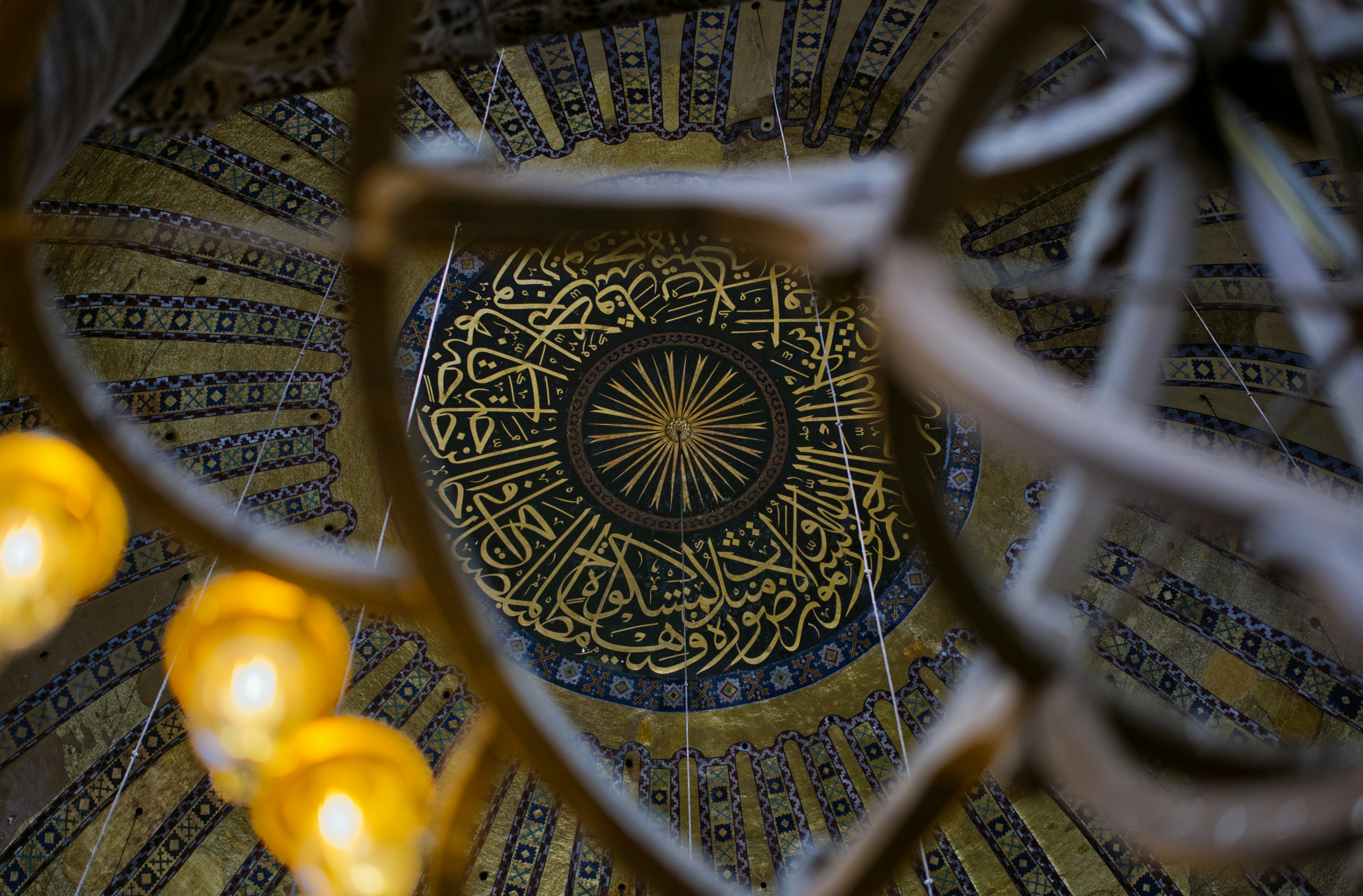Starburst Crown in a Calligraphic Dome Framed by Golden Orbs