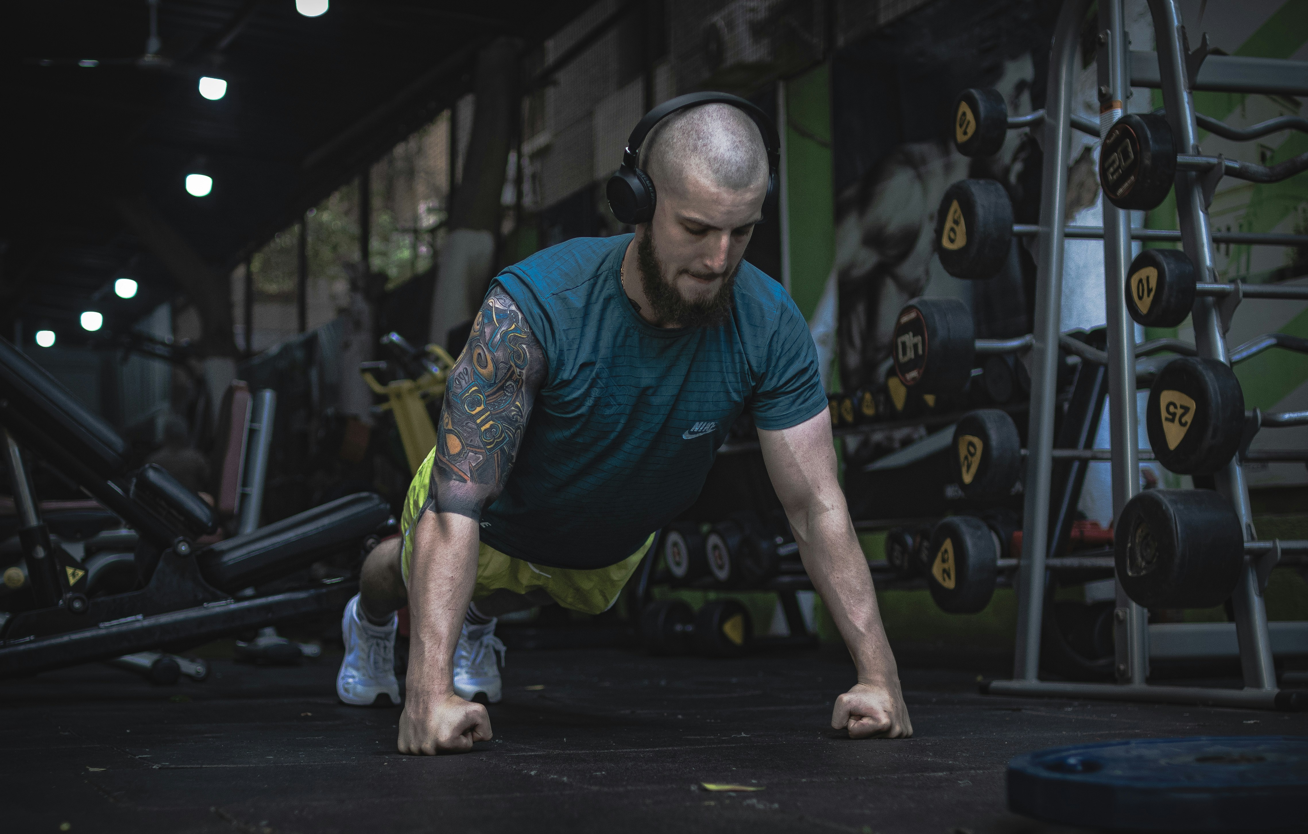 A man doing push ups in a gym photo – Free Gym Image on Unsplash