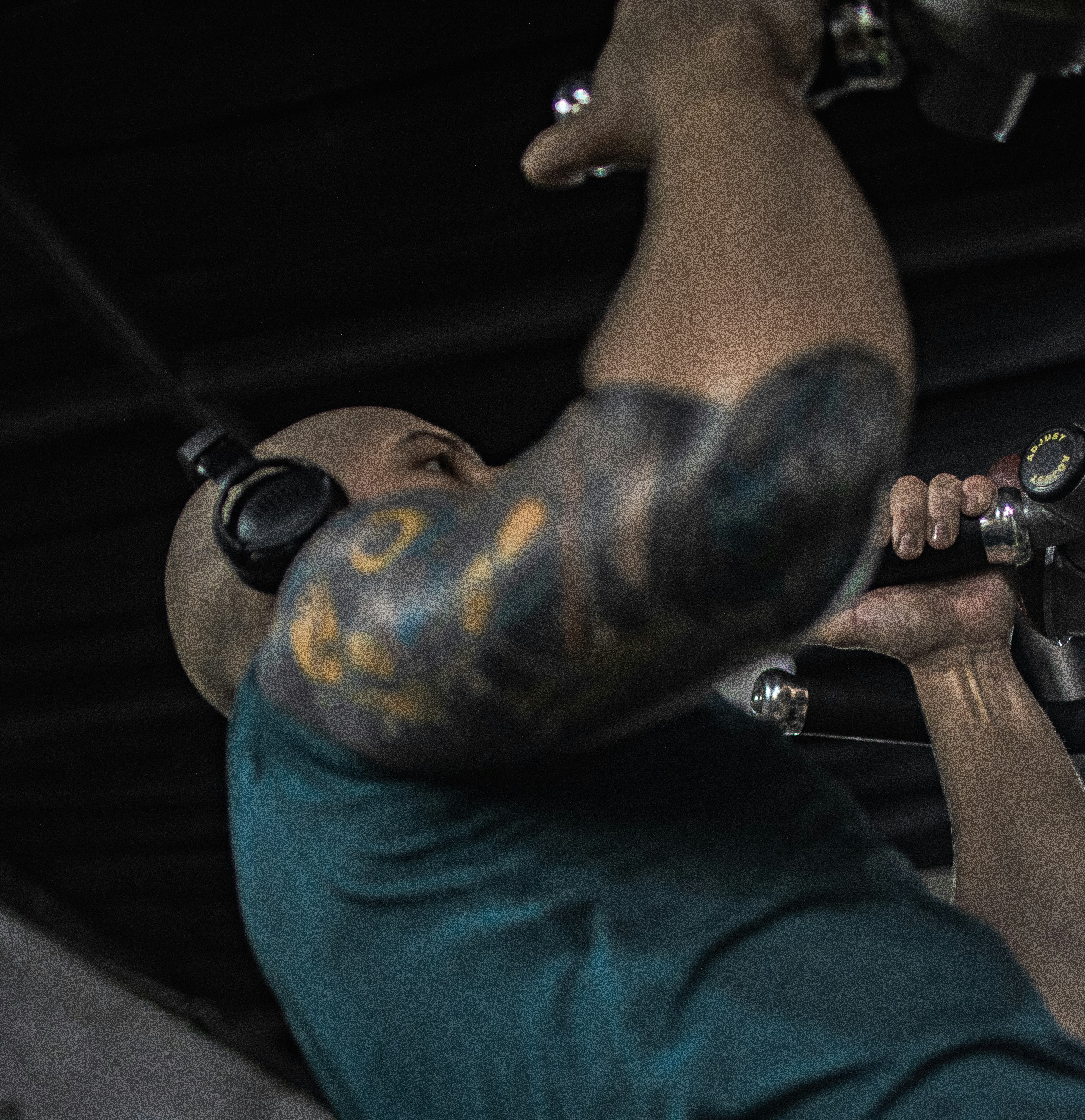 Ink and Iron: a Focused Lift Beneath Gym Fluorescents