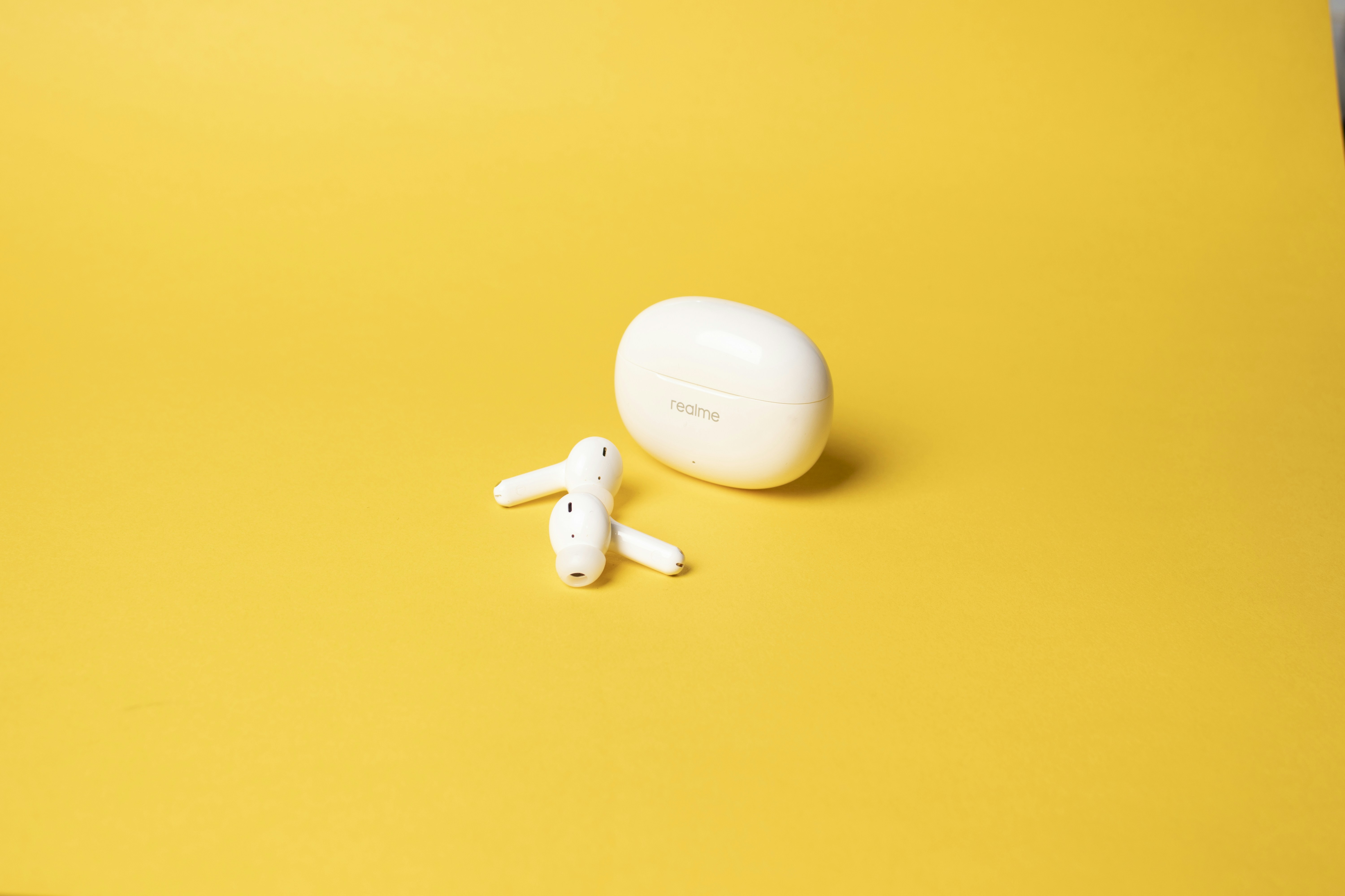 A small white object on a yellow surface photo – Free Toy Image on Unsplash