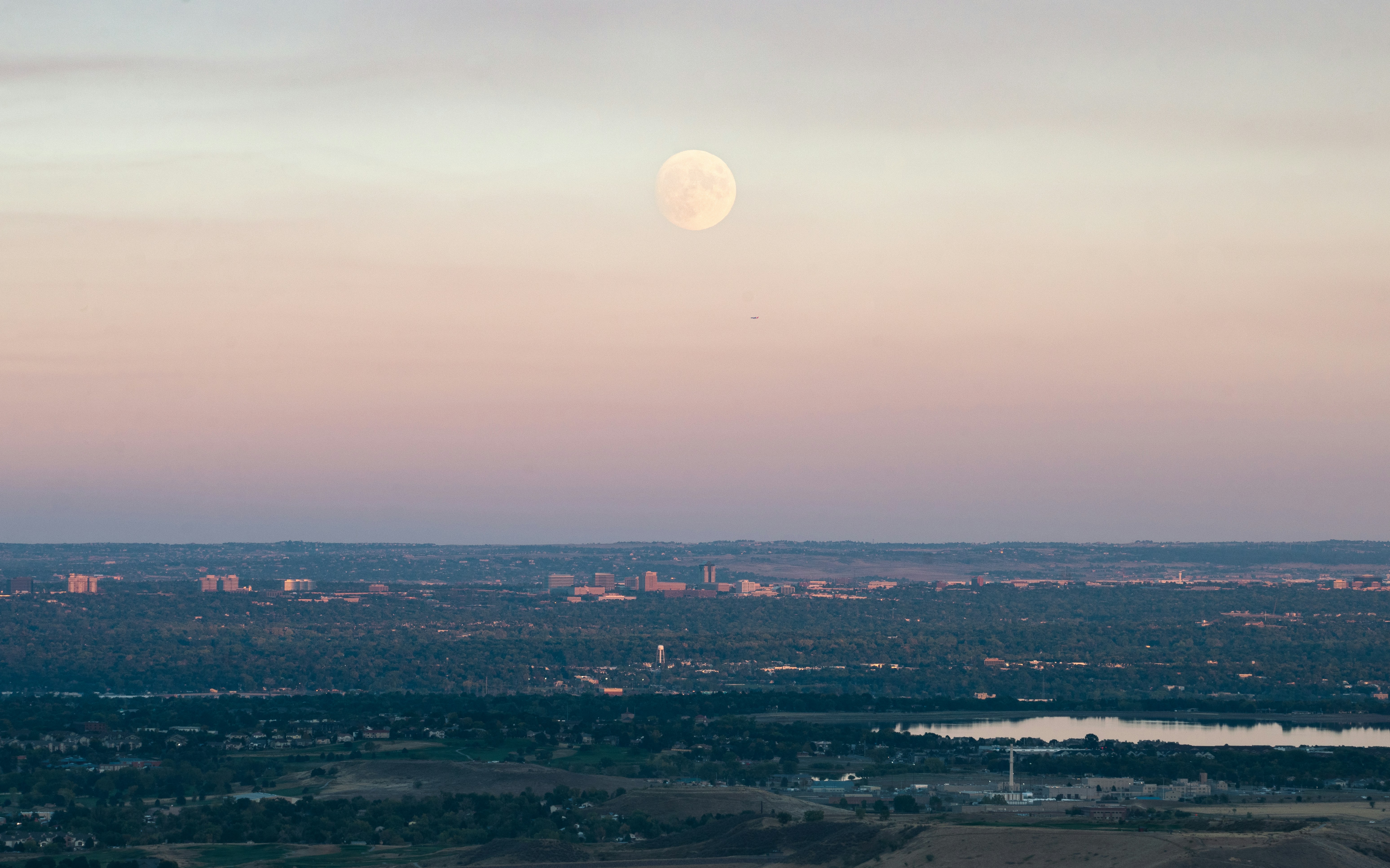 A view of a full moon over a city photo – Free Denver Image on Unsplash