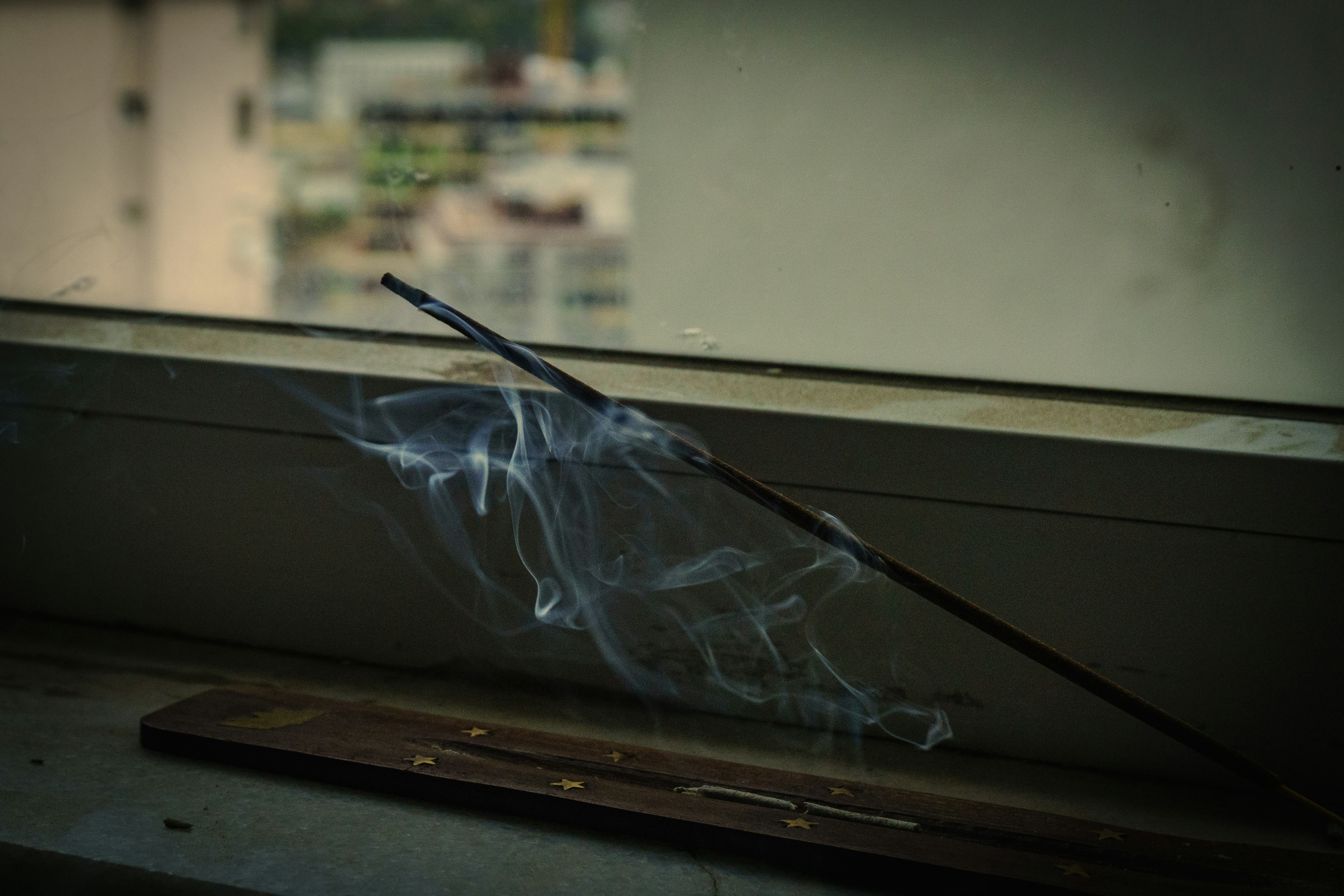 Whispering Diagonal: Smoke Trails Over a Quiet Windowsill