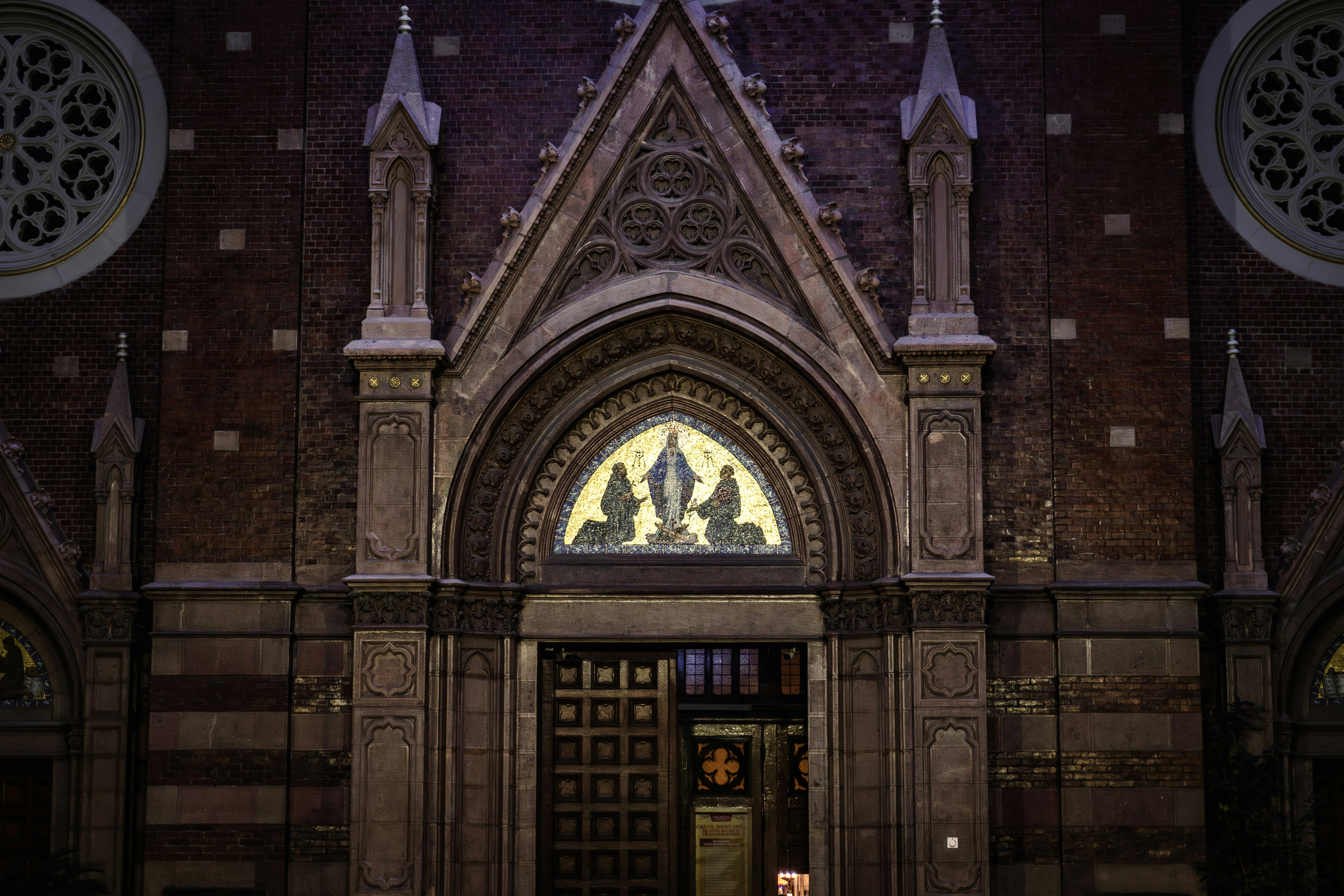 Gilded Portal: Night Facade of a Gothic Church