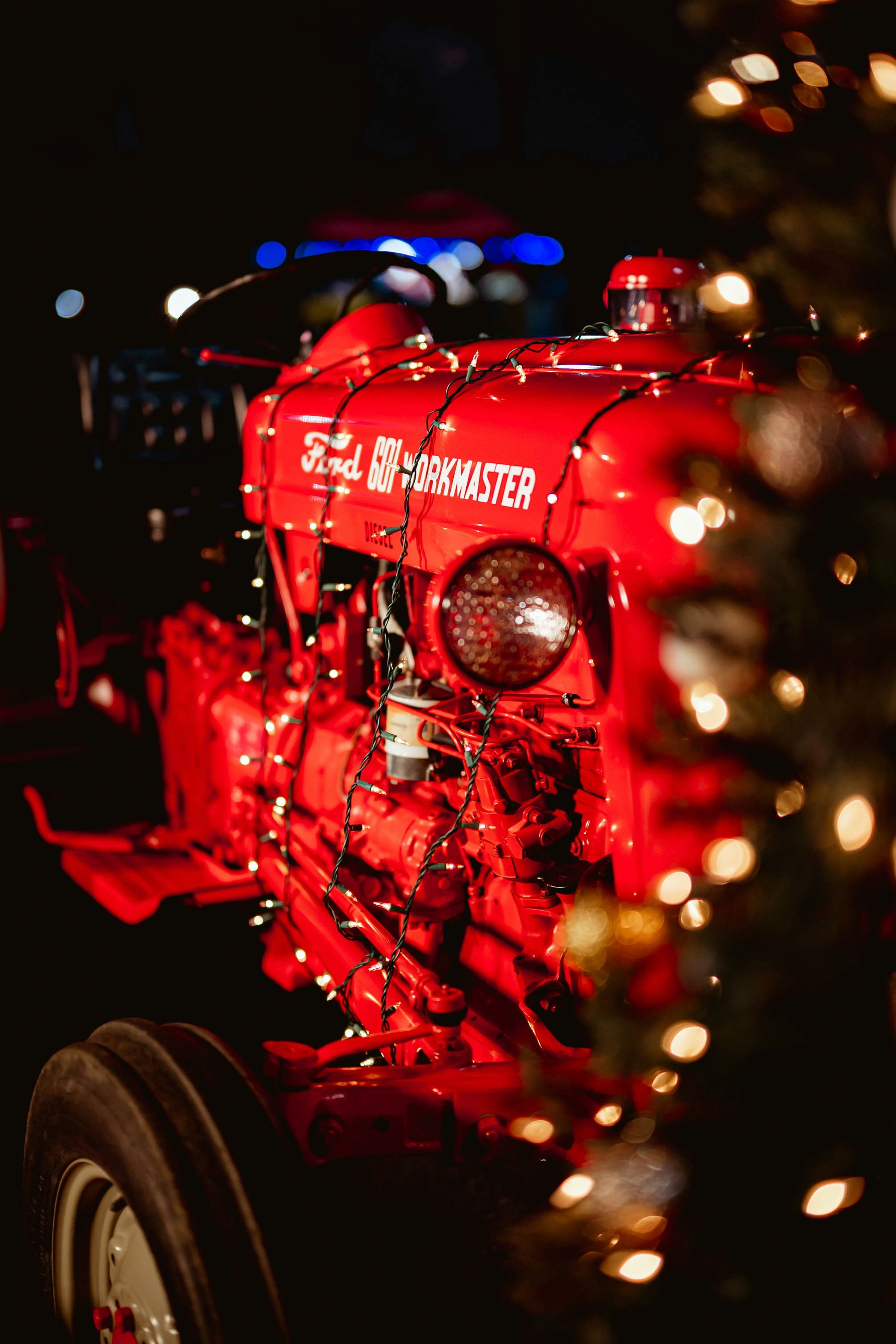 Crimson Vintage Engine Wrapped in Christmas Lights