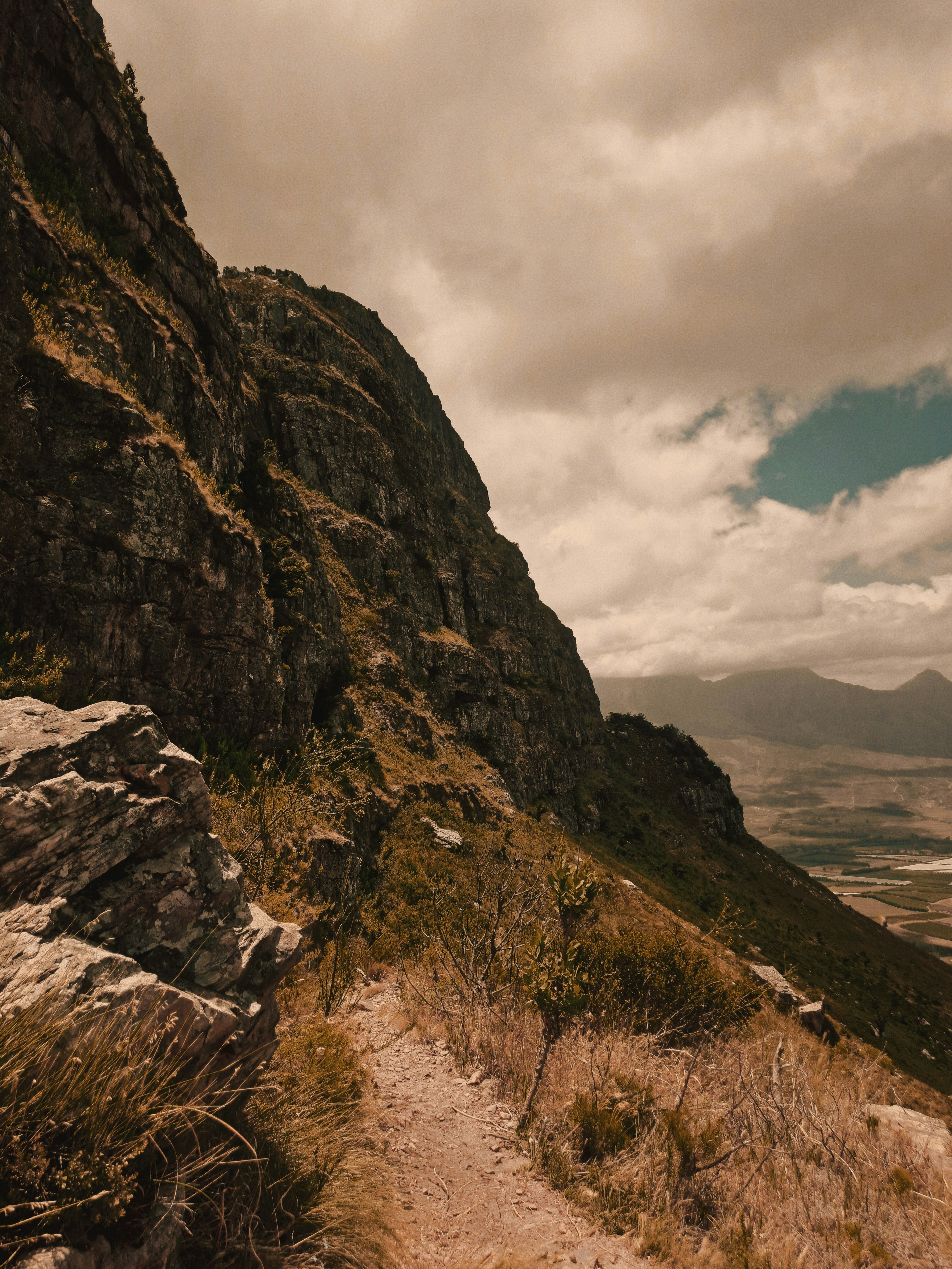 A rocky mountain side with a trail going up it photo – Free Rock Image ...