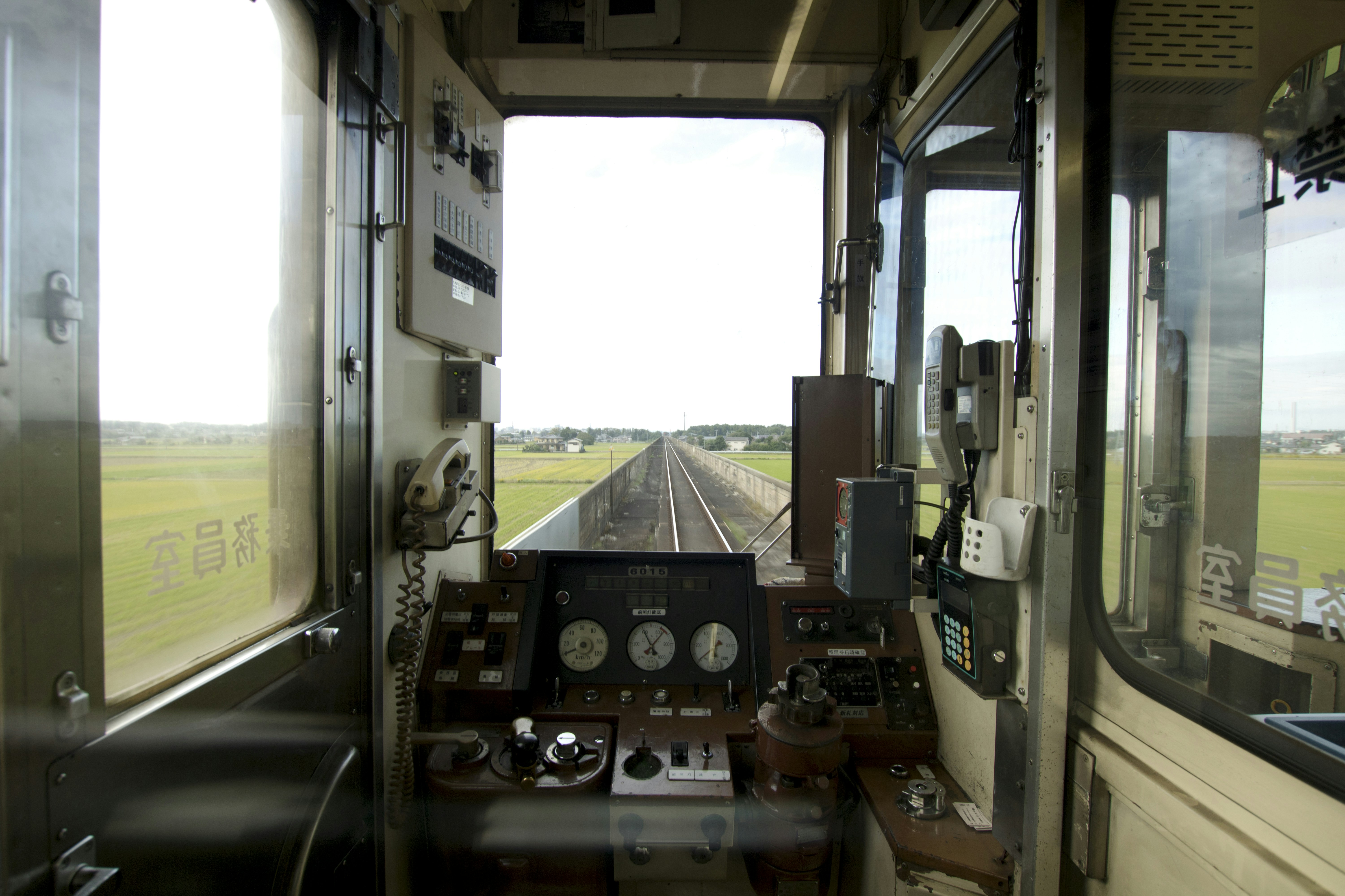Conductor's View: The Rails Unfold Toward a Distant Horizon