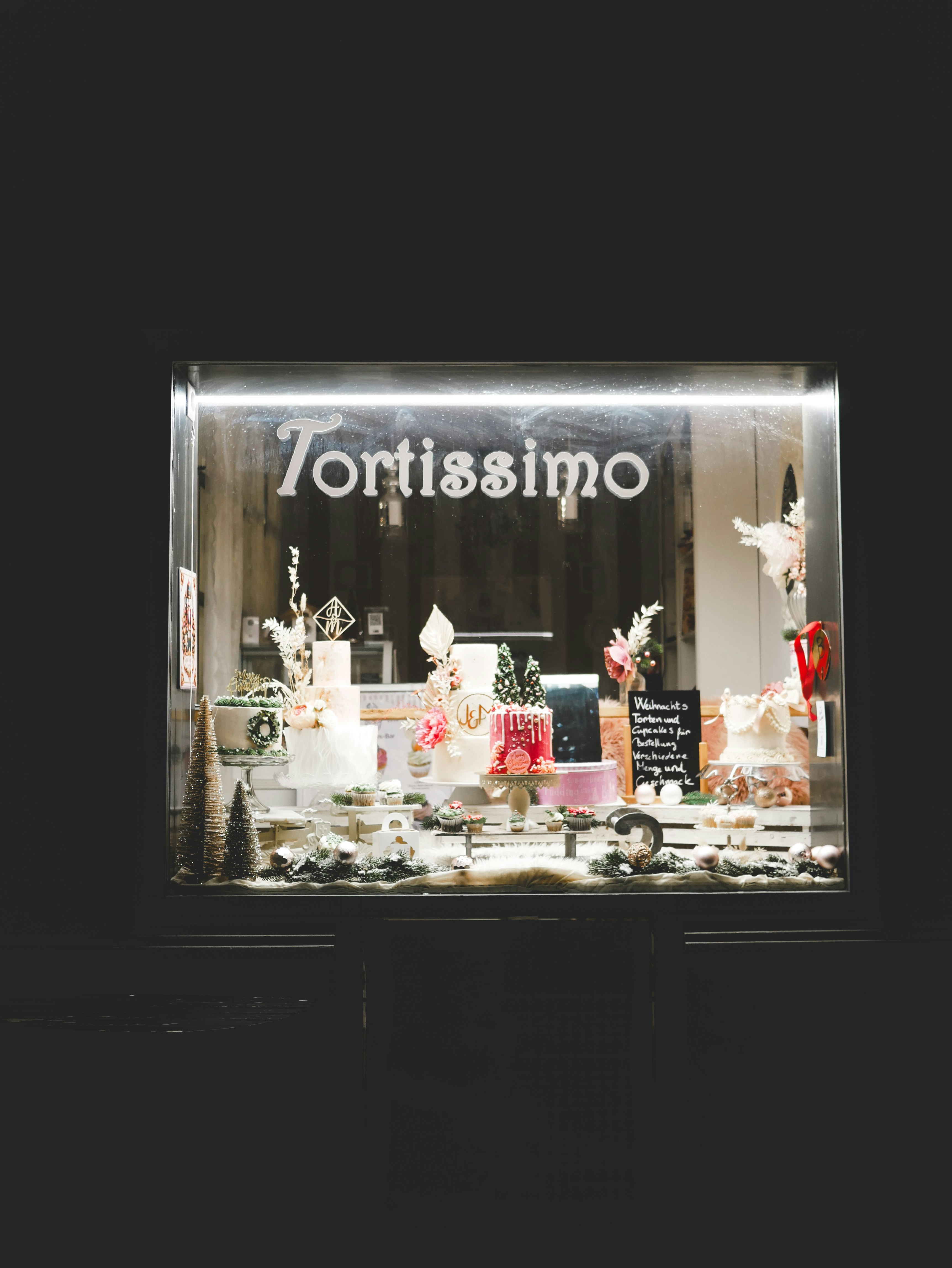 A store front window with a lit up display photo – Free Baden Image on ...