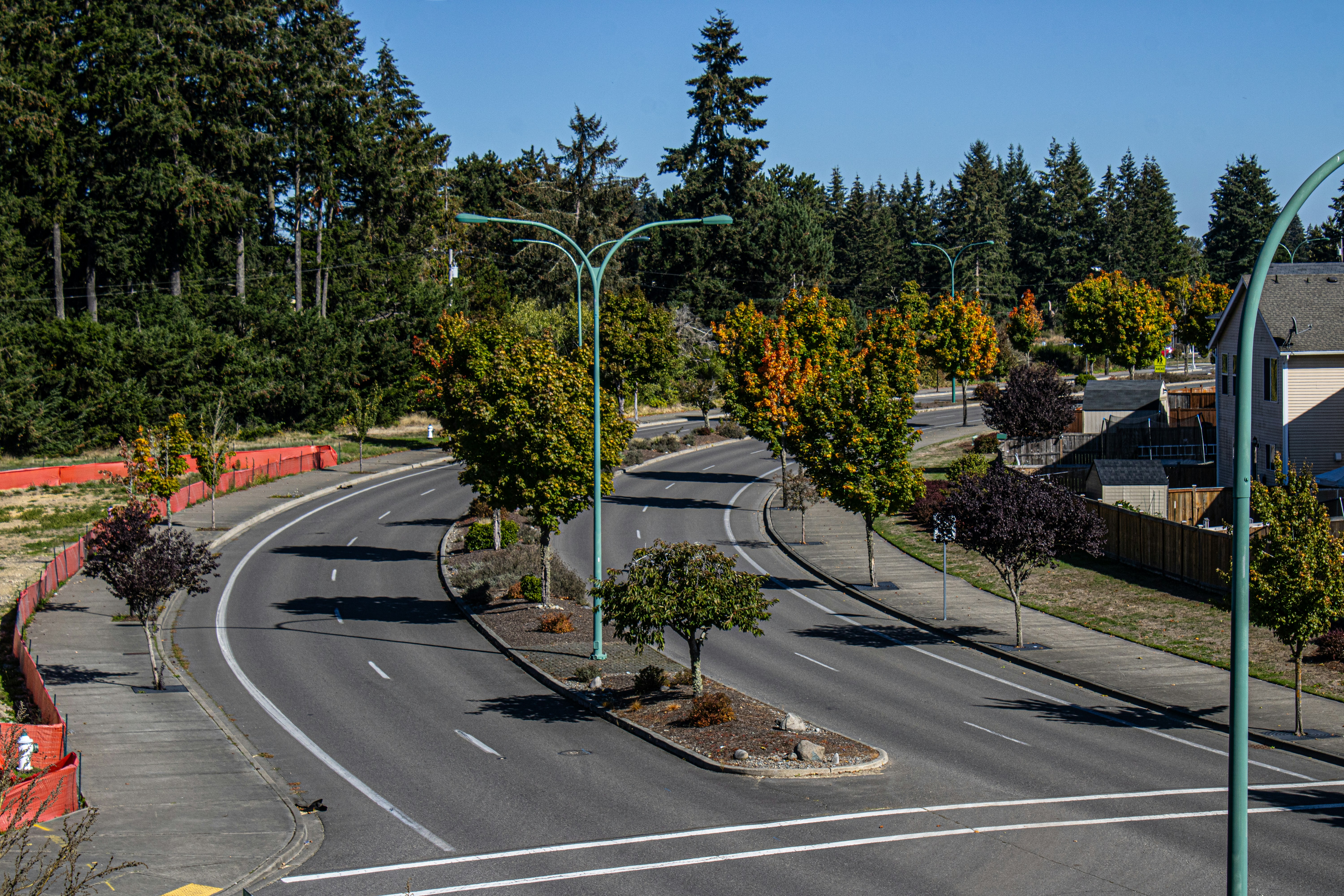 A street with a curve in the middle of it photo – Free Yelm Image on ...