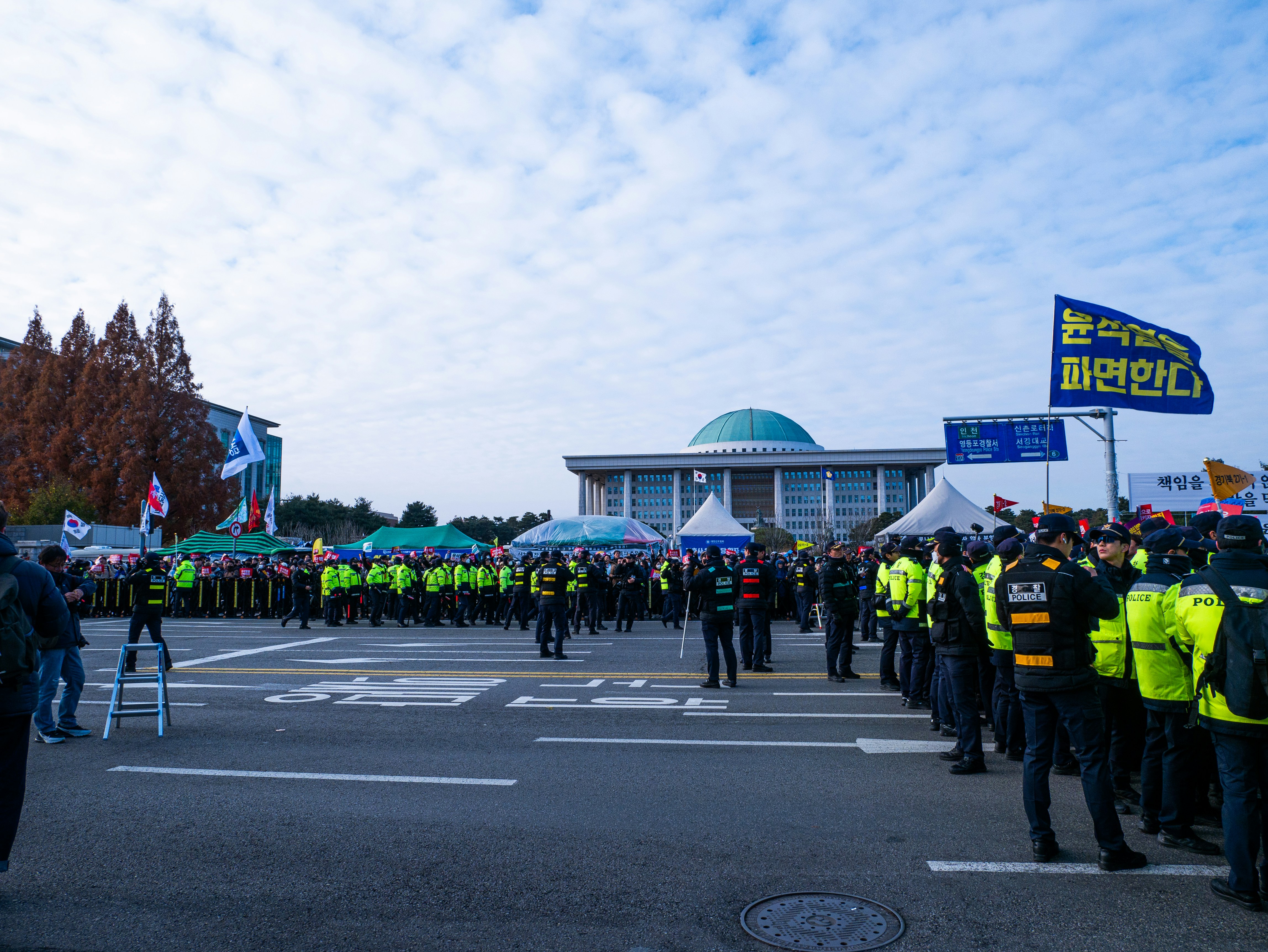 A group of police officers standing in front of a crowd of people photo ...