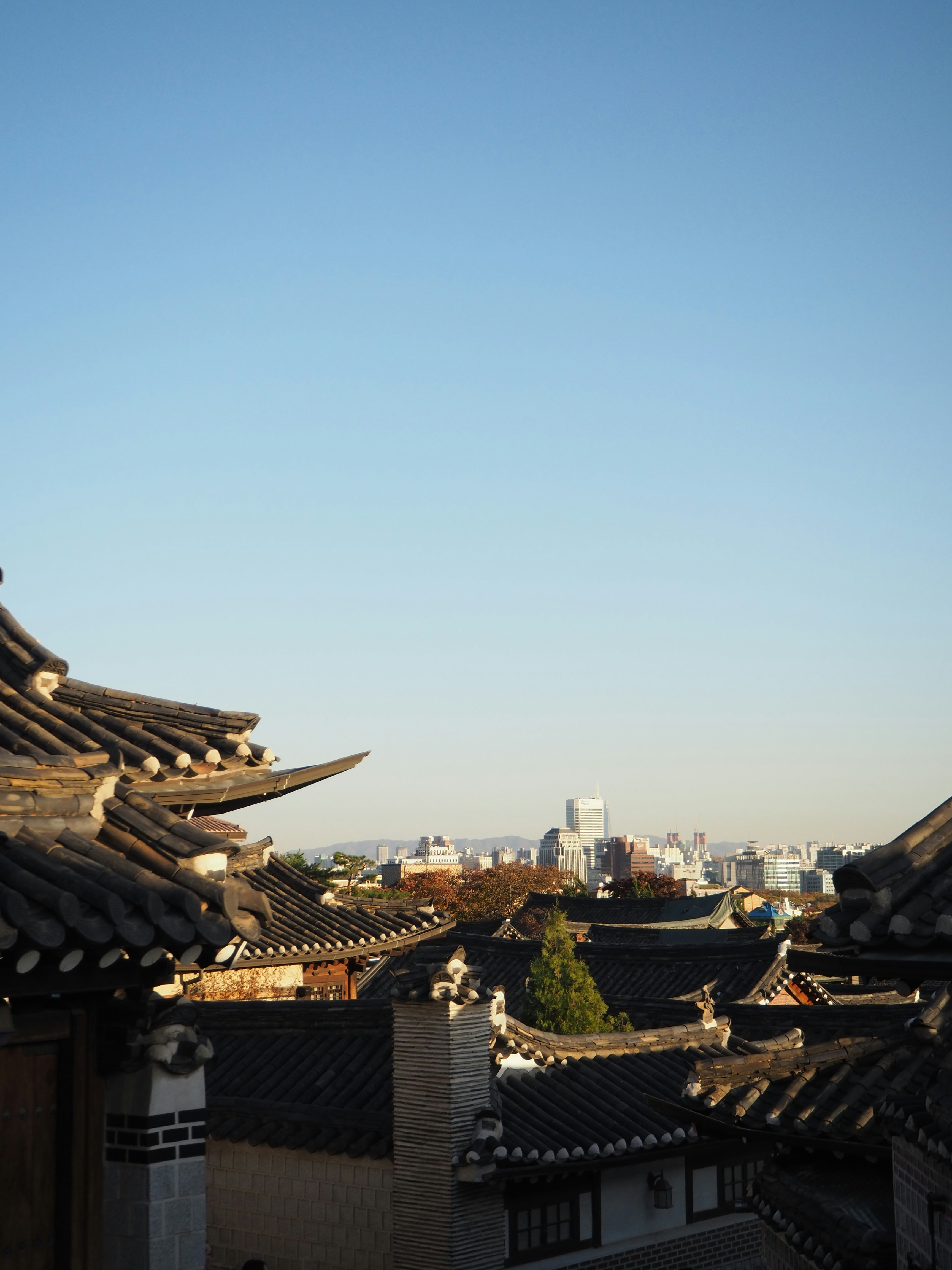A view of a city from a roof top photo – Free Sunrise Image on Unsplash