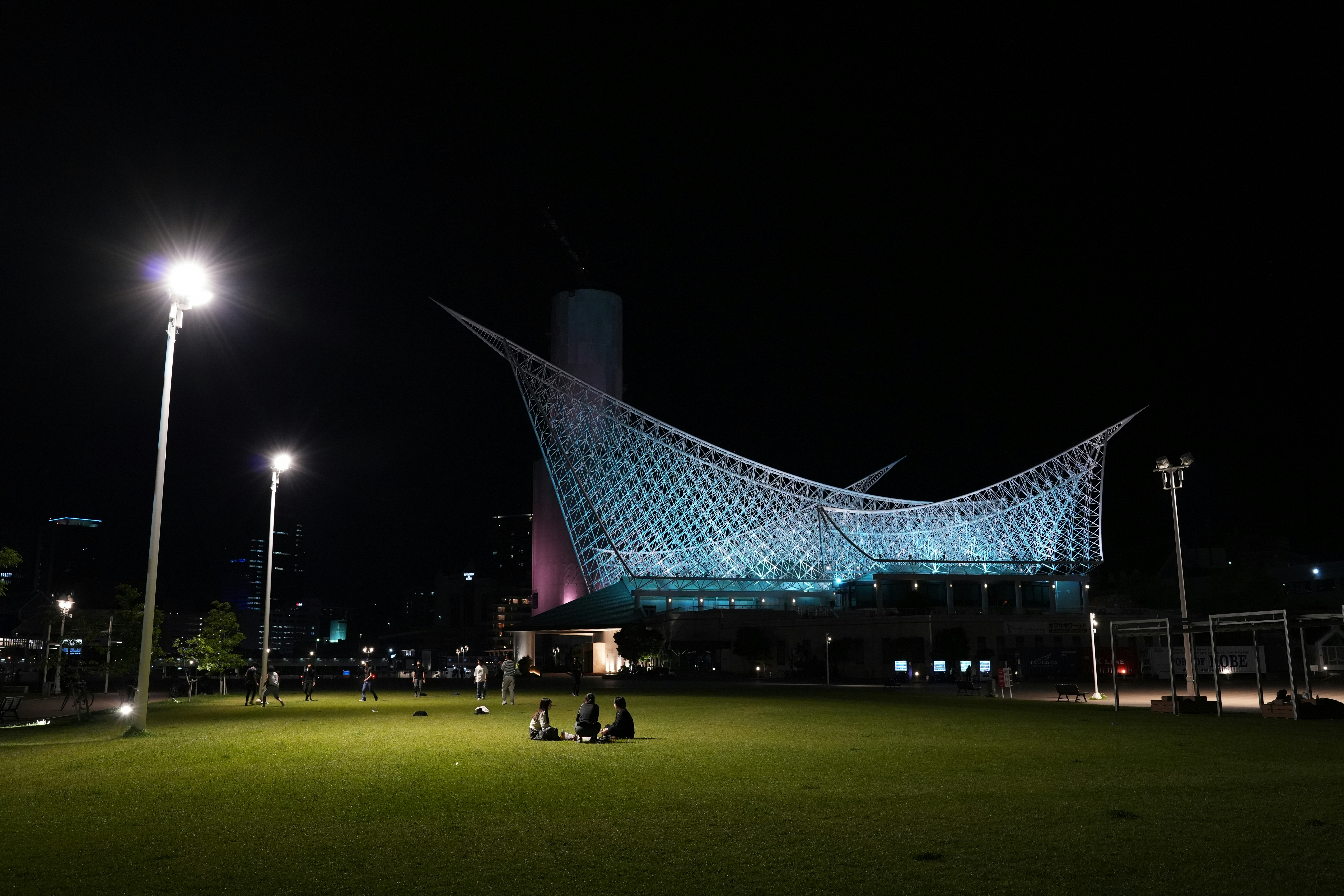 Blue-Sailed Glass Pavilion Illuminates the Night Park