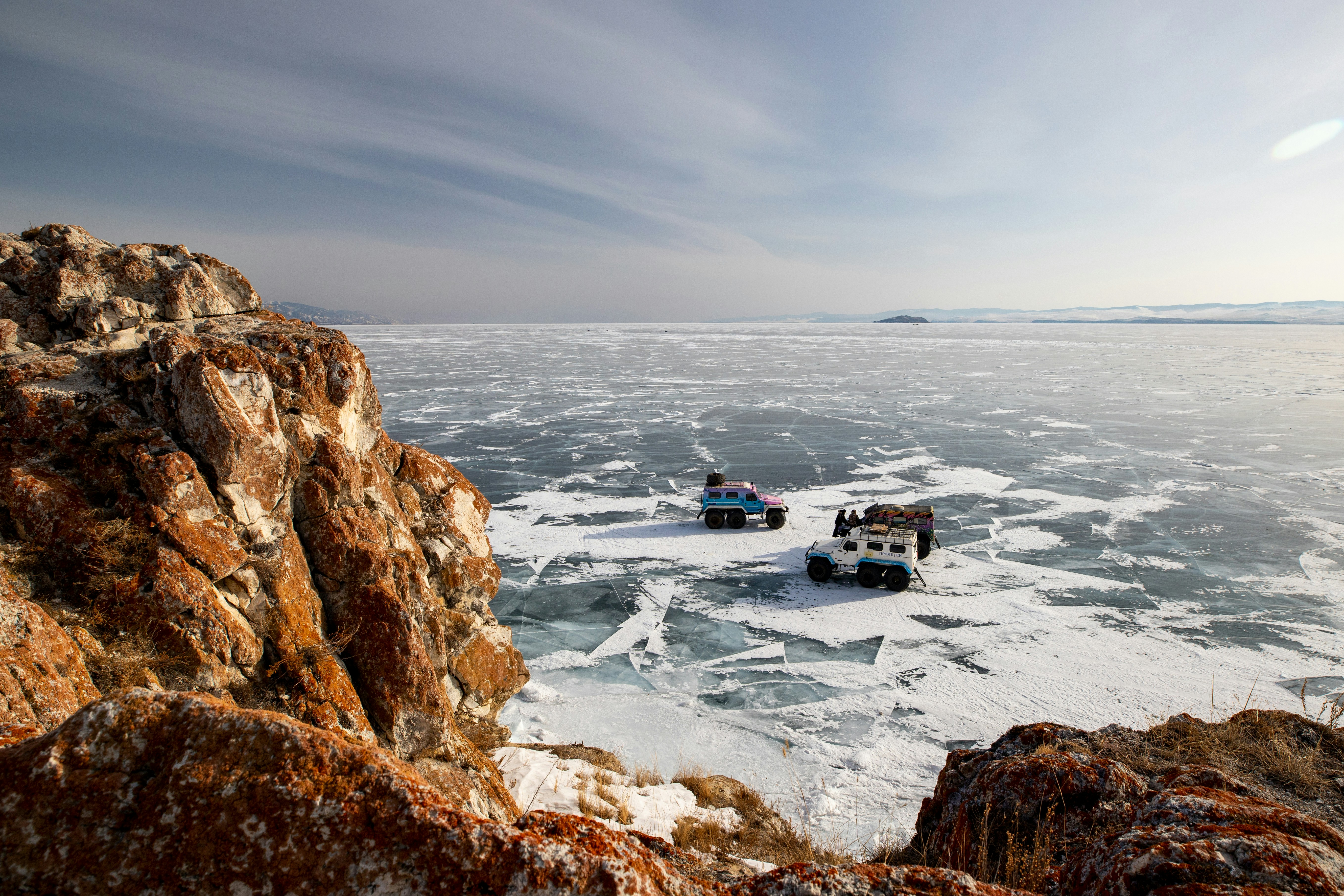 A couple of boats floating on top of a large body of water photo – Free ...