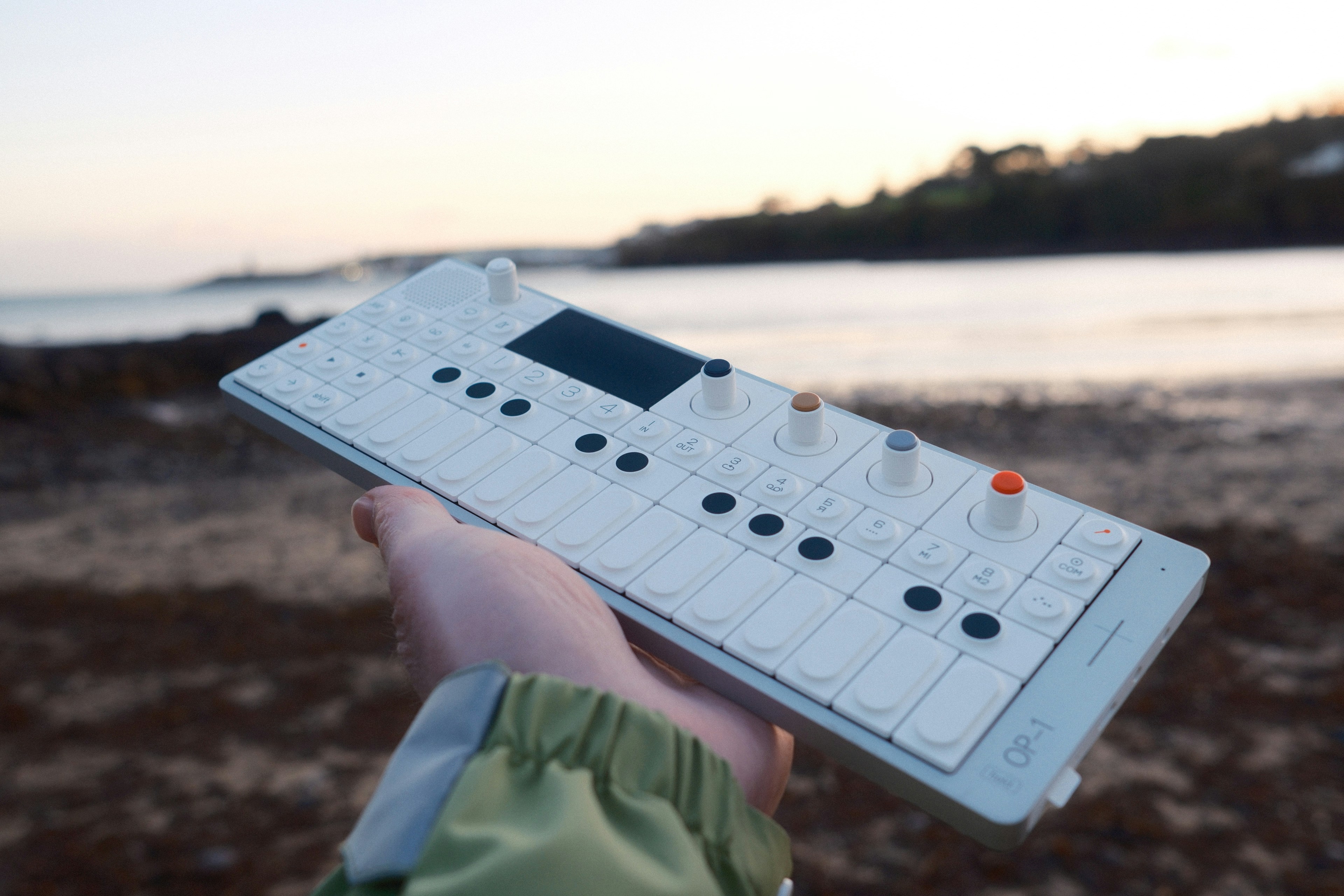 A person holding a remote control in their hand photo – Free ...