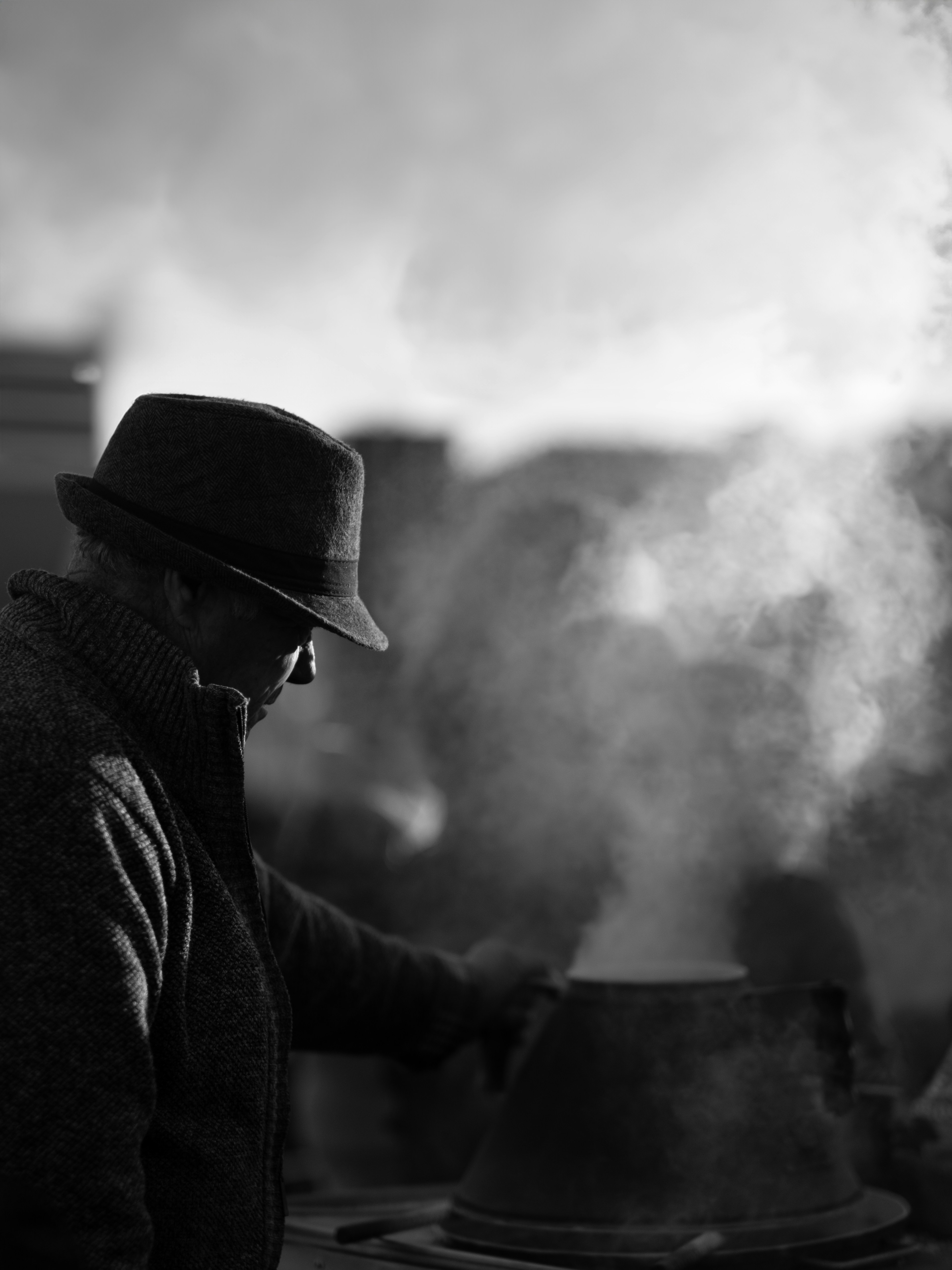 Shadowed Barber Slice: A Quiet Portrait Amid Steam and Smoke